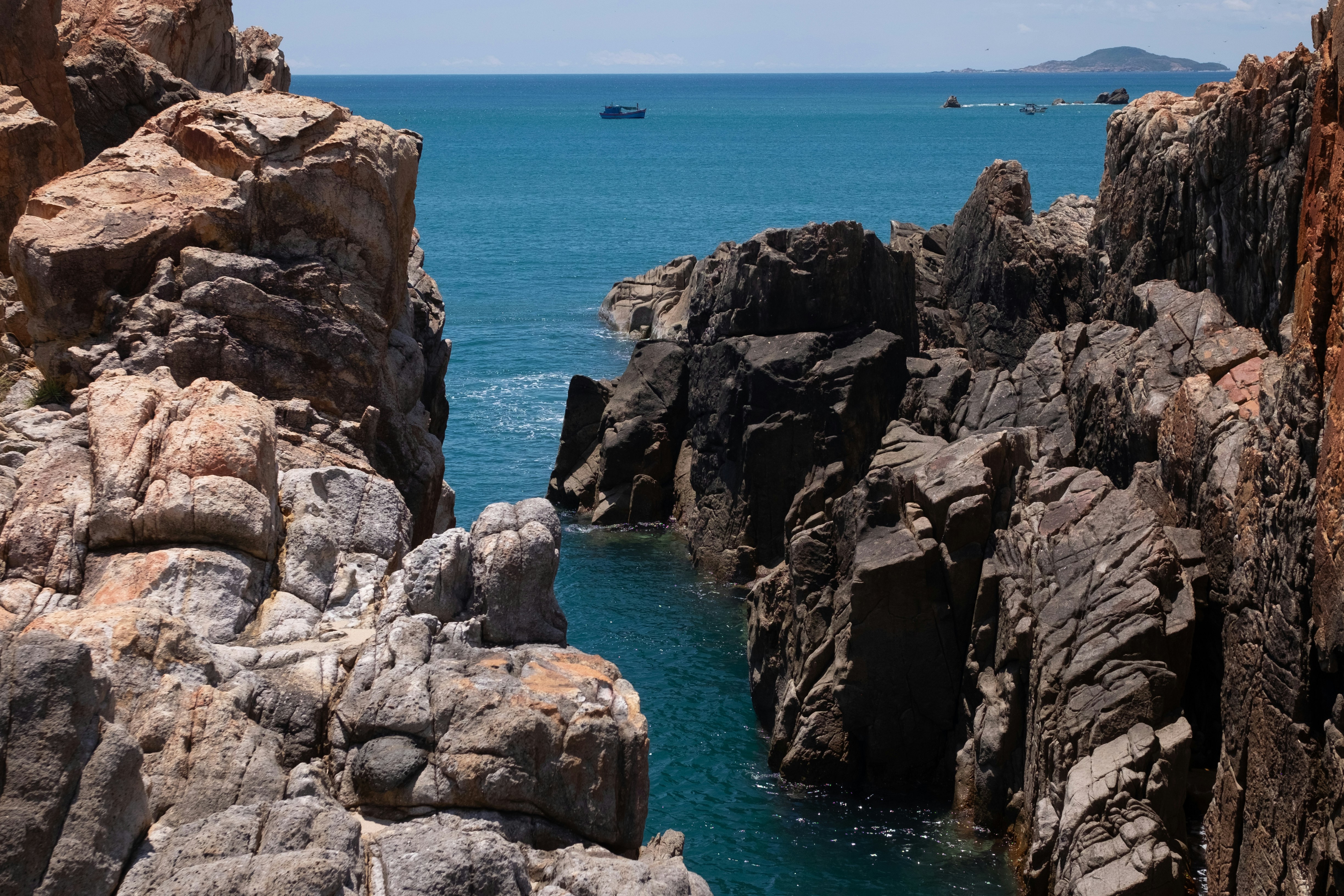 Cavernous Seascape Between Weathered Gorges