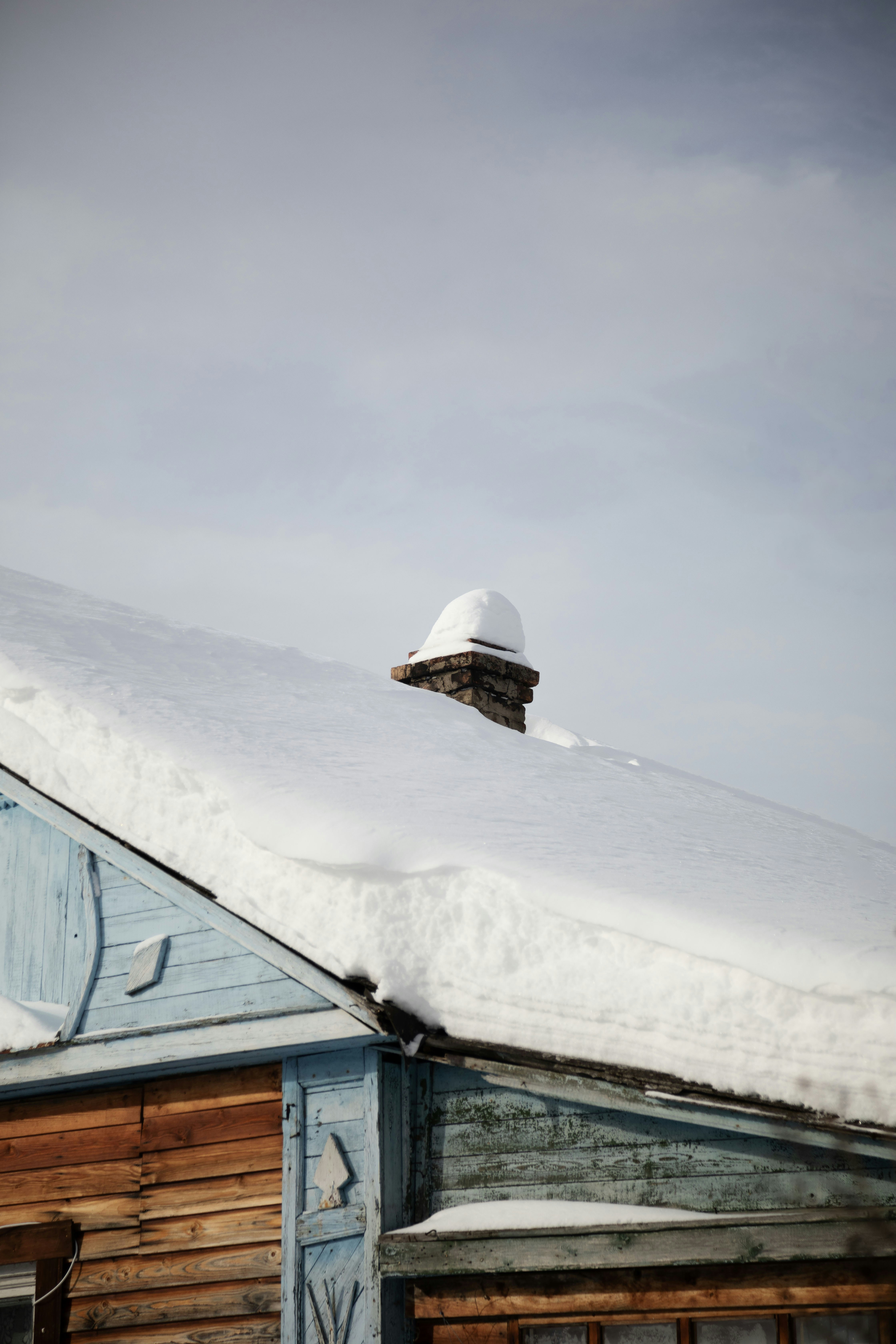 Snowbound Chimney Crest on a Nordic Roof