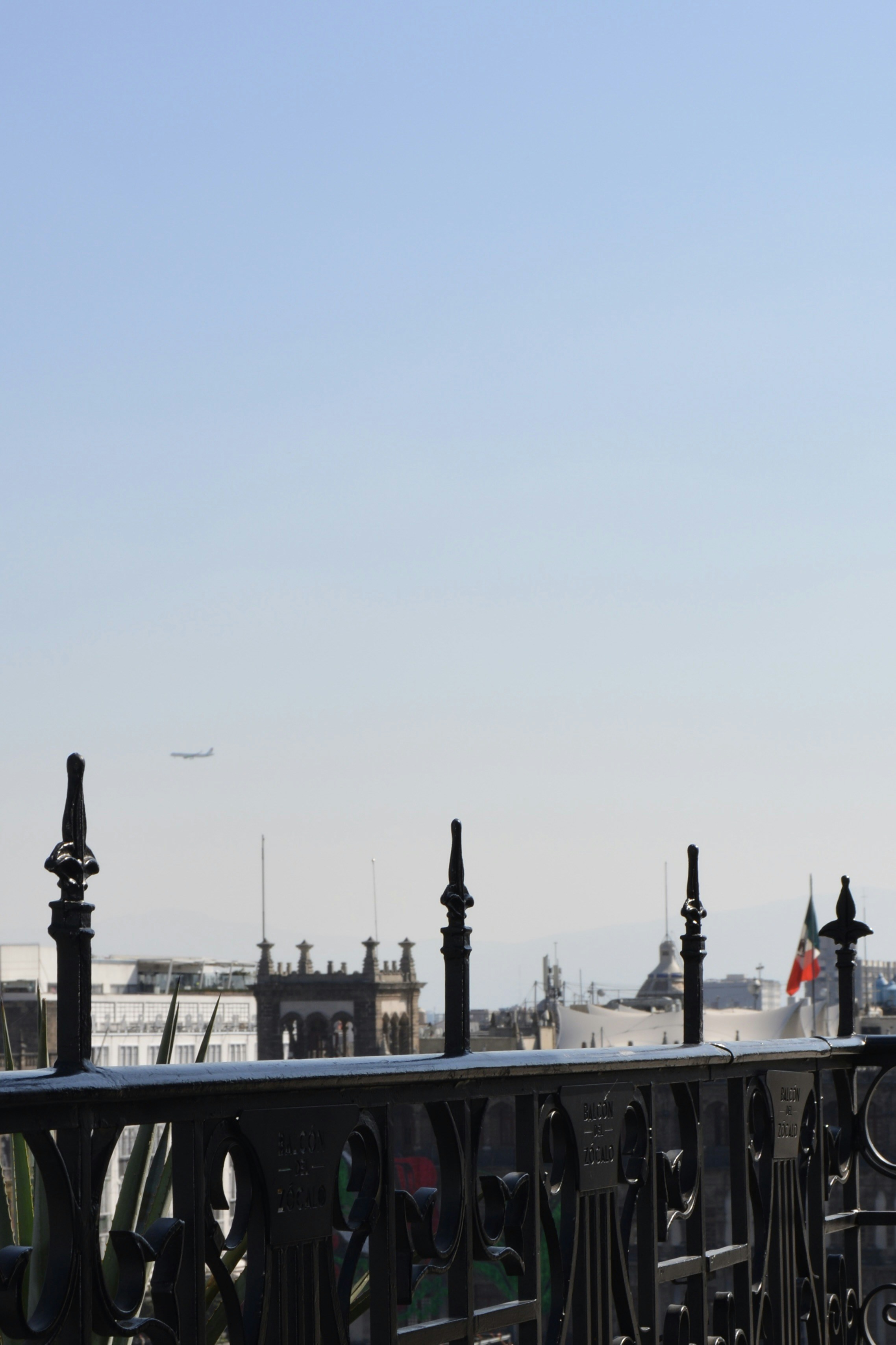Ironwork Silhouettes Over the Parisian Railings at Dusk