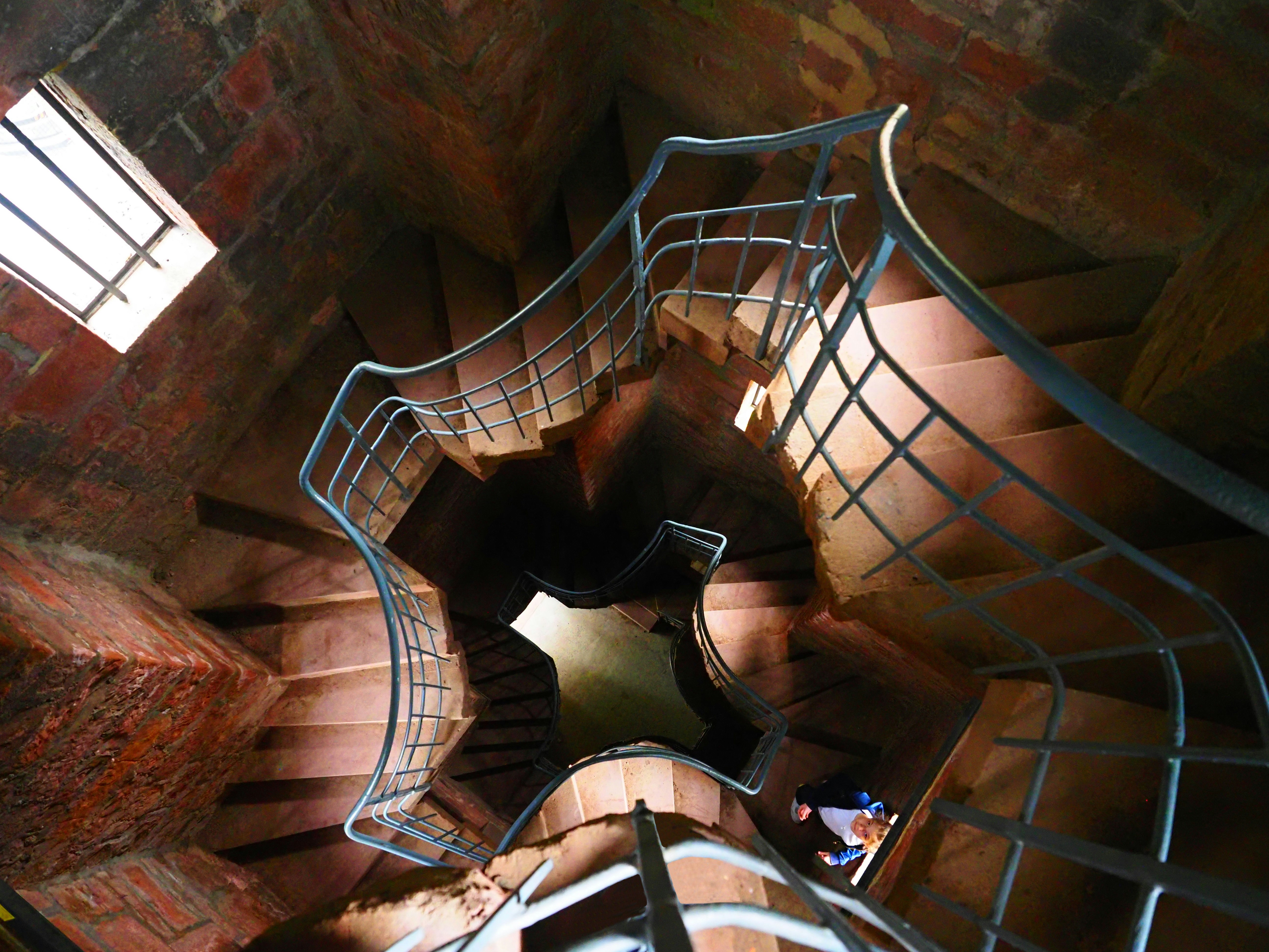 Spiral Descent: An Eye through the Winding Brick Core