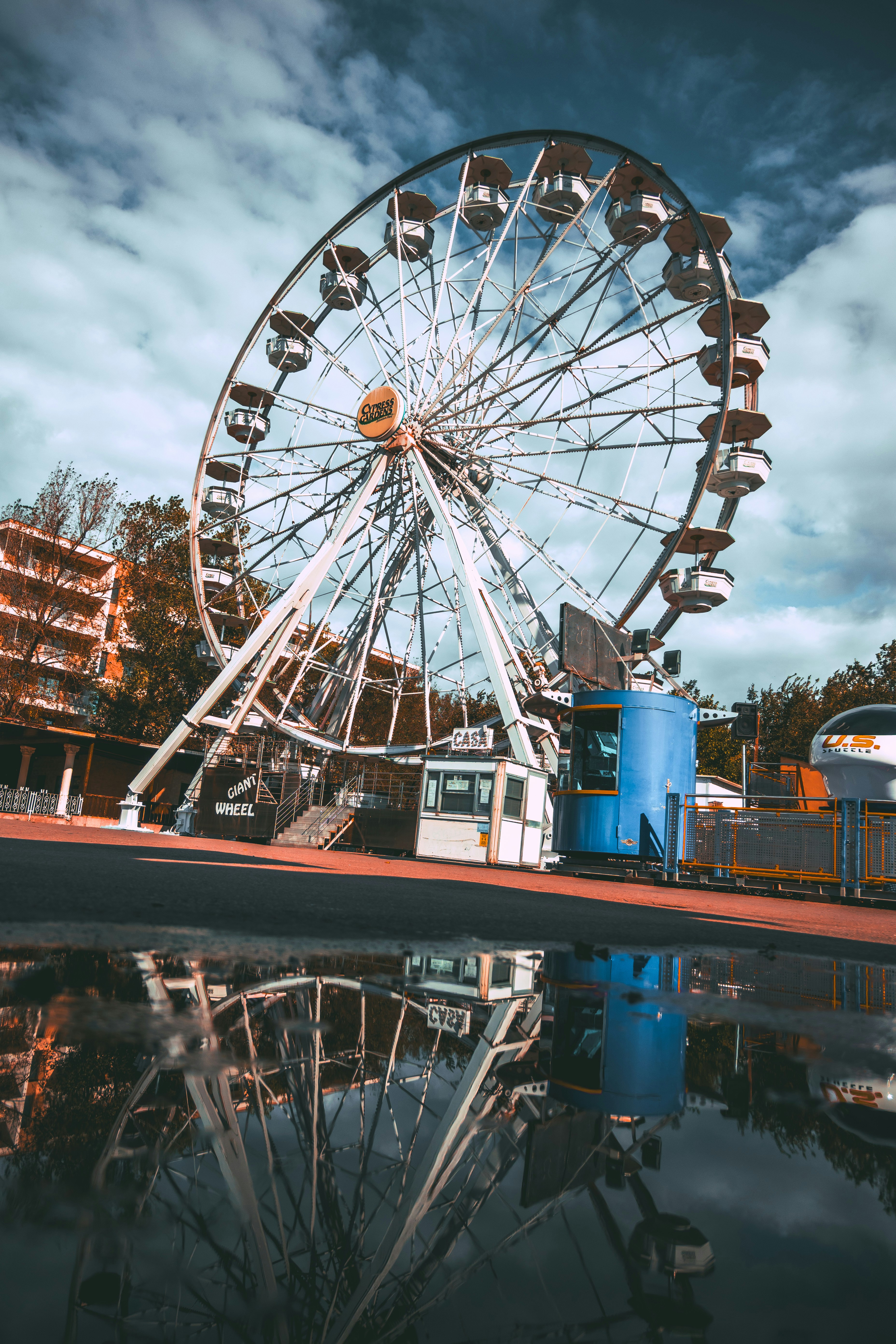 Gigantic Wheel, Quiet Reflection: A Carnival in a Moment of Stillness