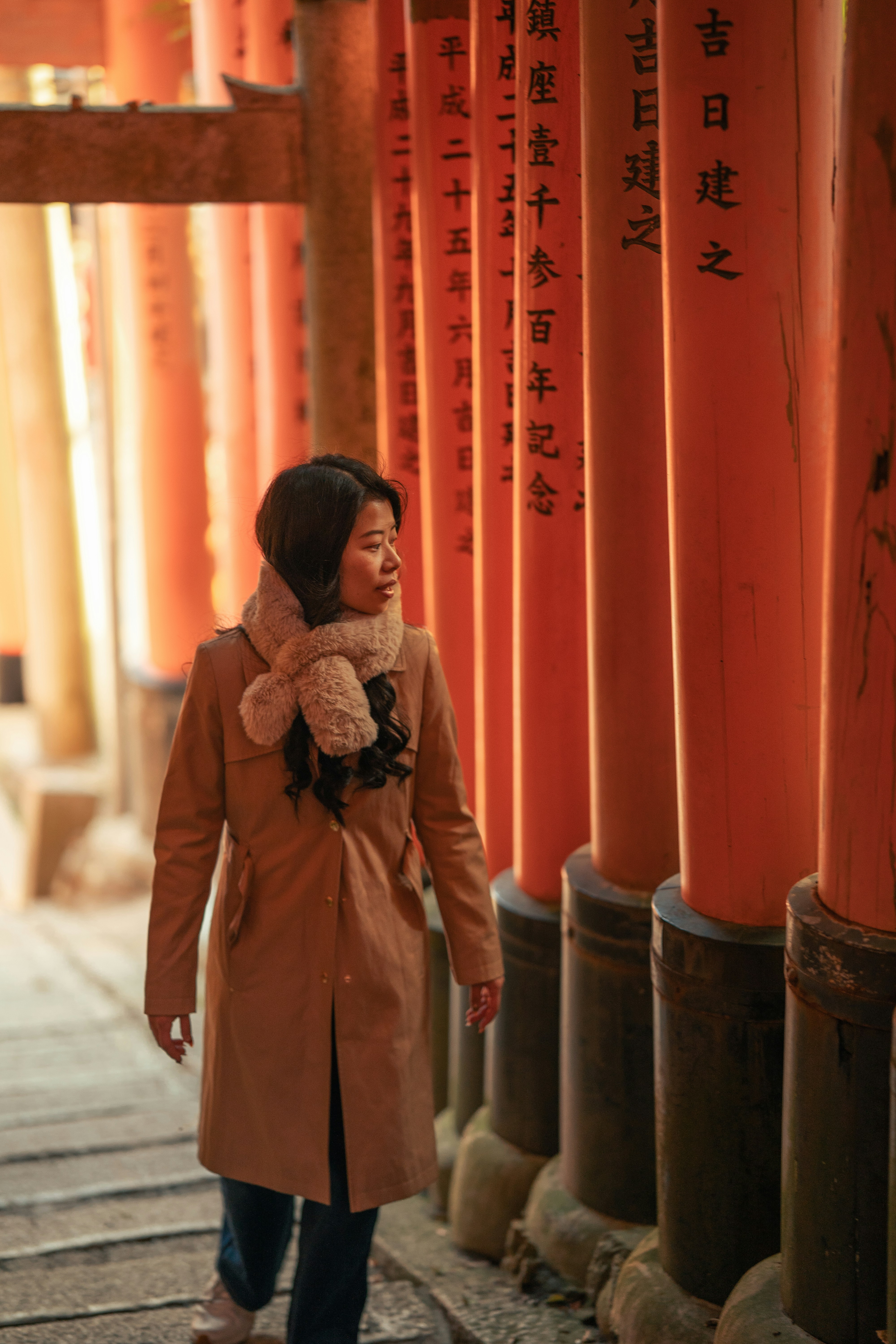 Between Pillars: A Silent Stroll Under Scarlet Rows
