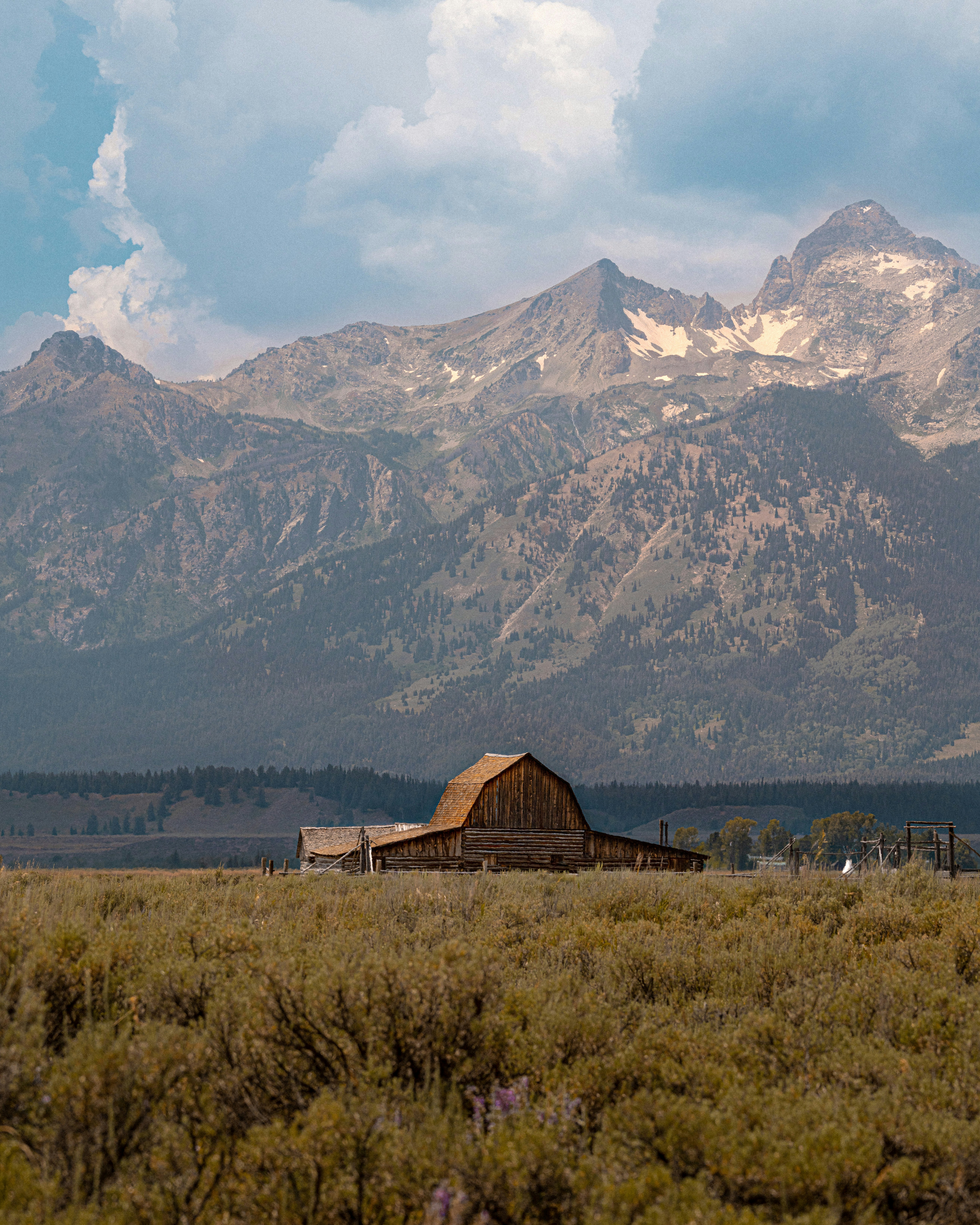 Frontier Barn at the Foot of Snow-Capped Peaks