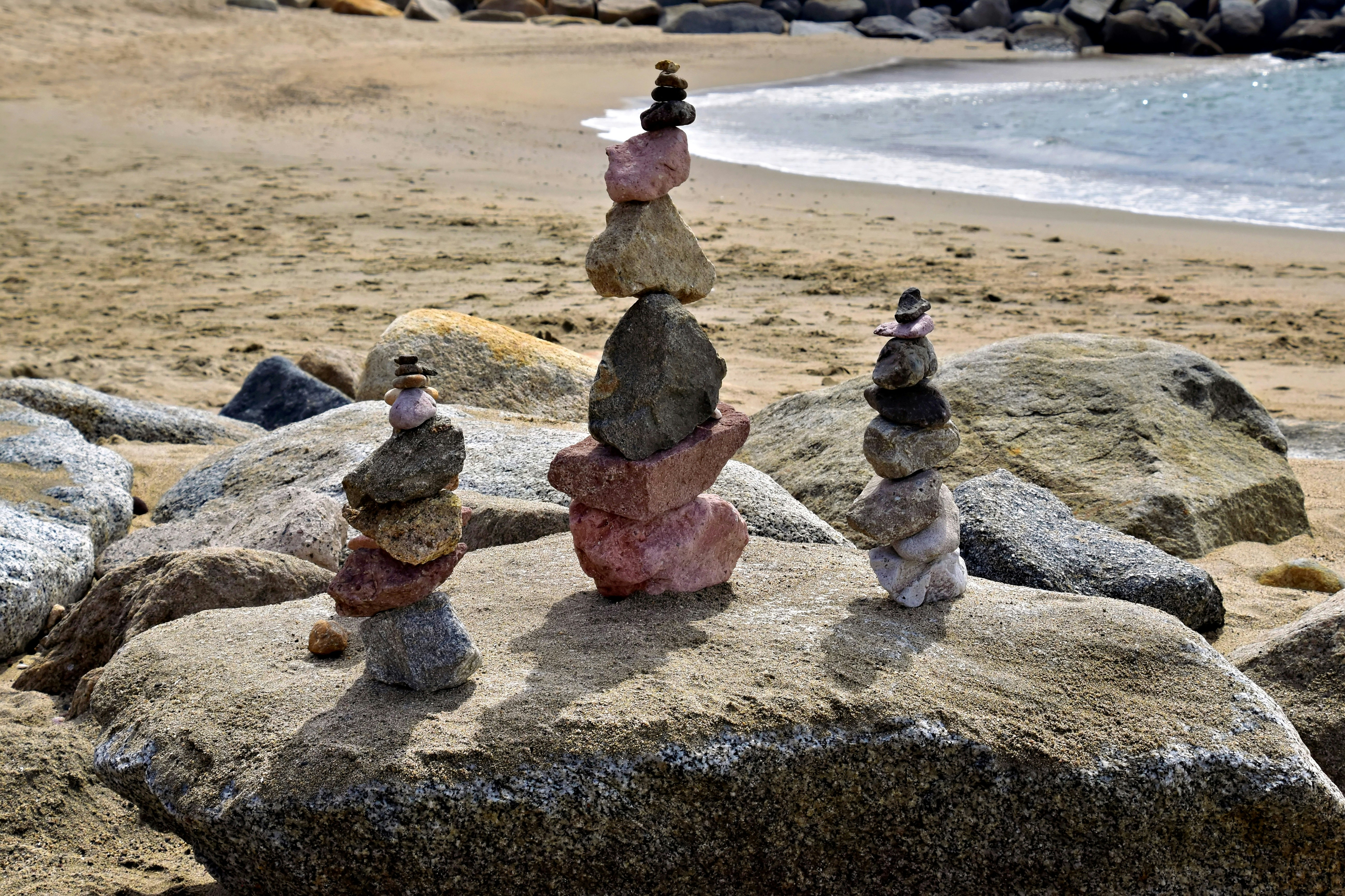 Balance of Stones: Tiny Towers on a Seaside Altar