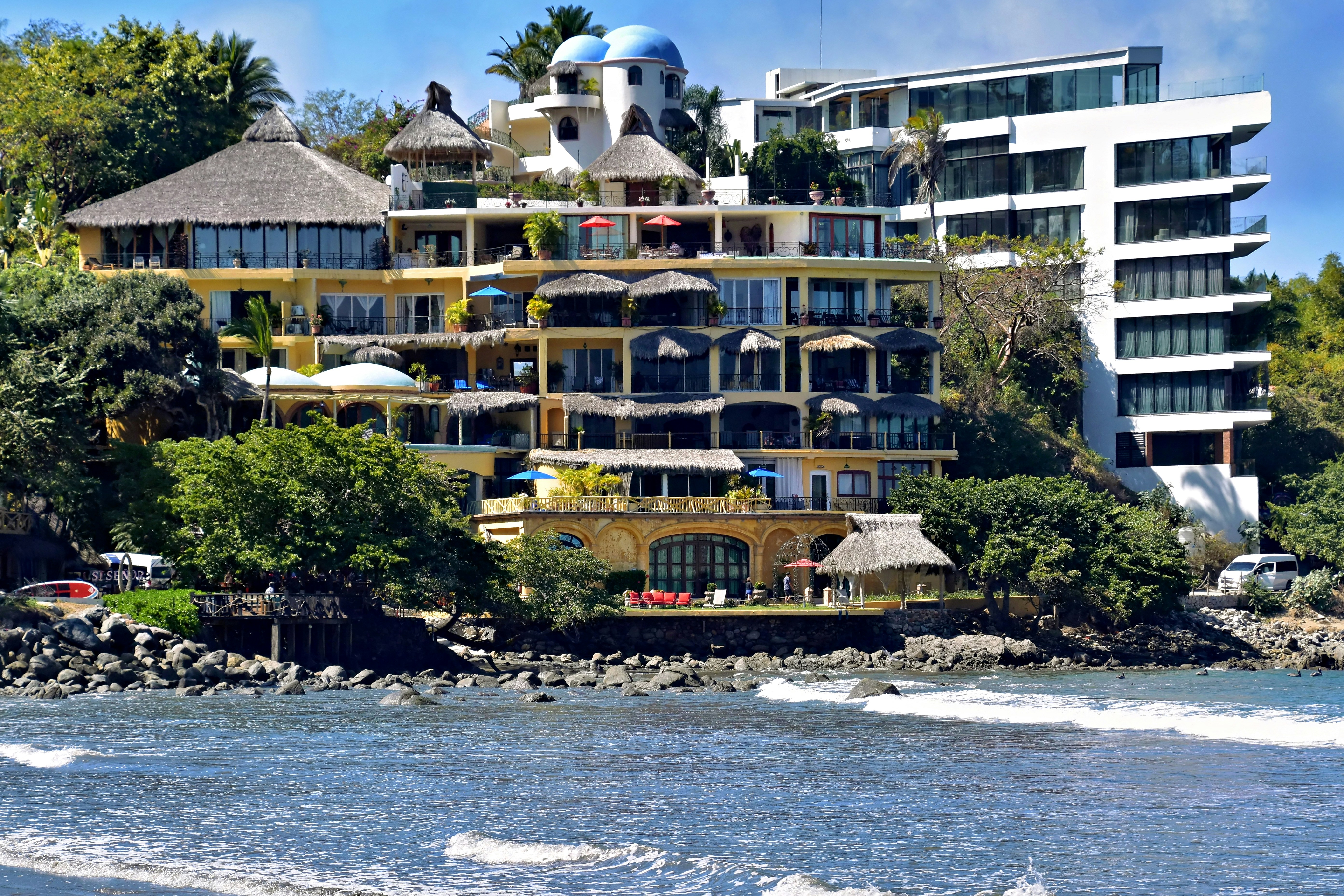 Seaside Cliffside Resort Rising Above Lapping Waves