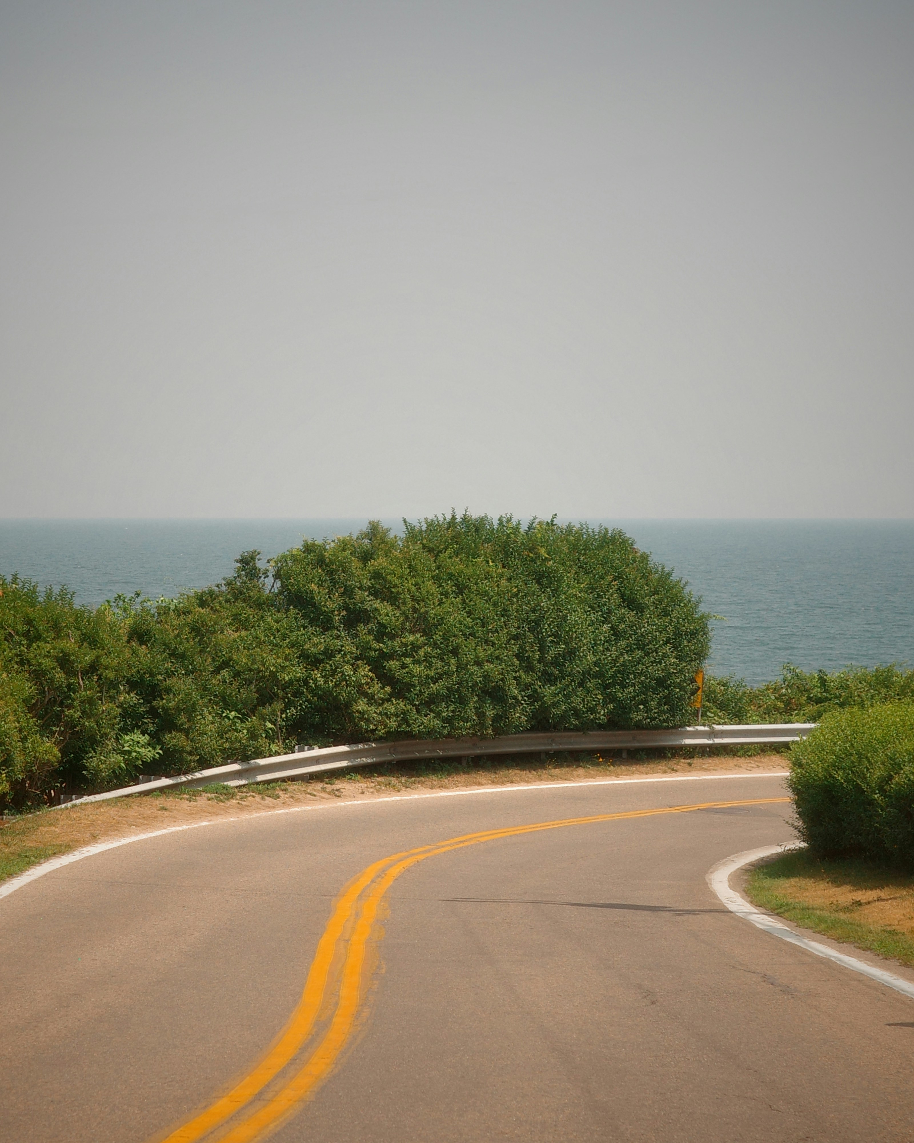 Curved Coastal Road Leading Toward the Sea