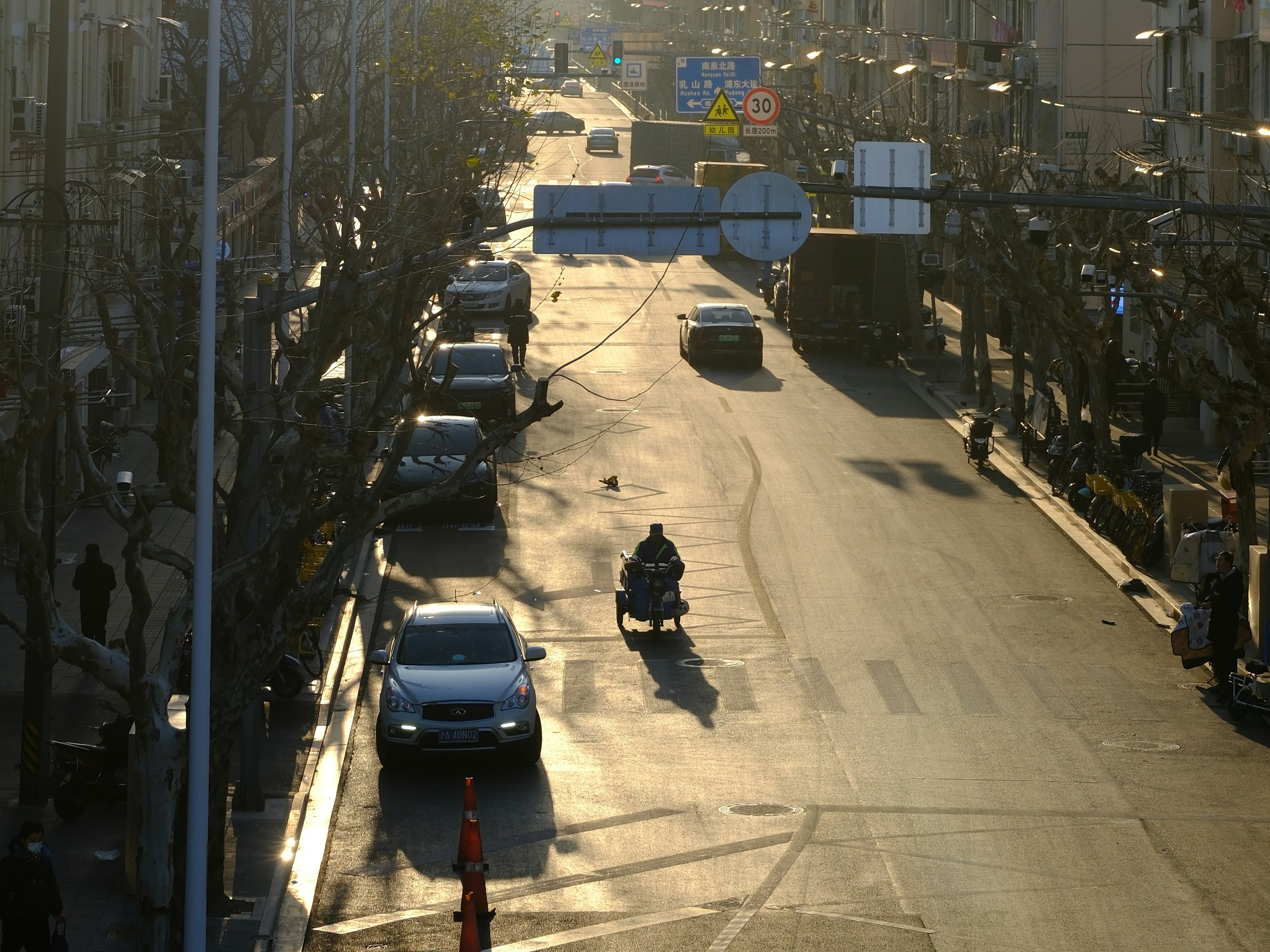Golden Hour Rush: A Quiet City Street in Transit