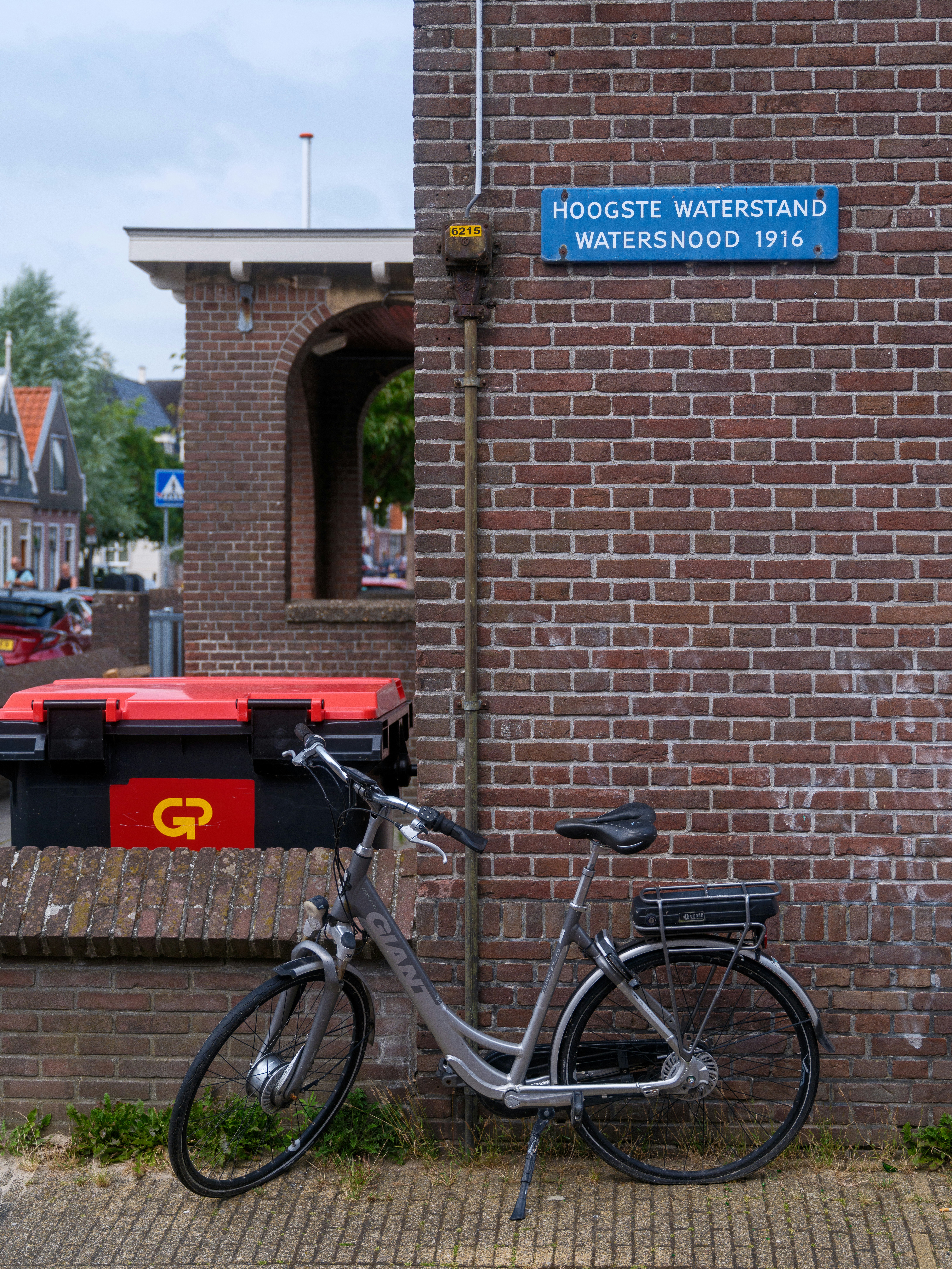 Brick Wall, Bicycle, and Historic Waterway Sign
