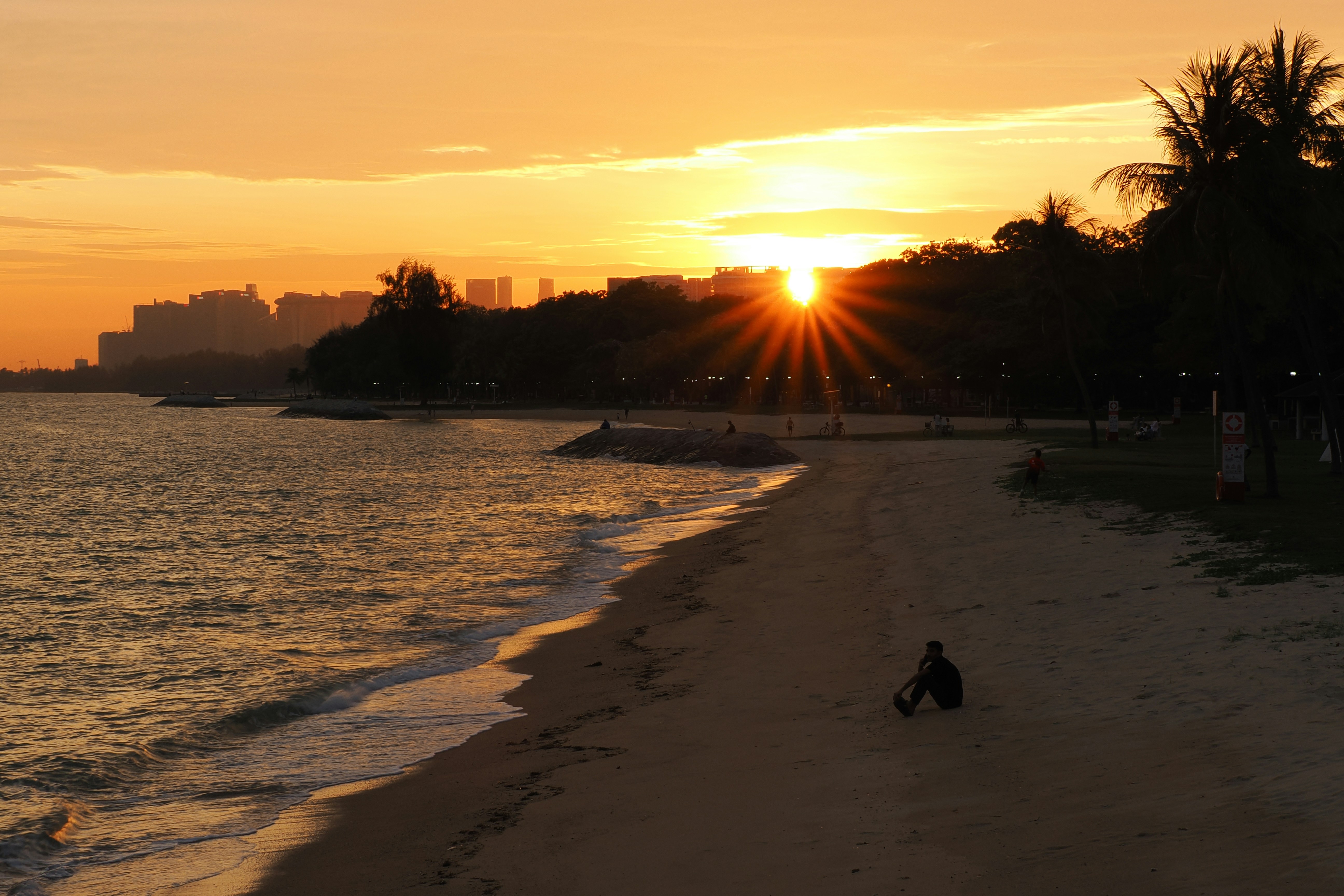 Sunrise on the Quiet Beach: A Silhouette by the Shore