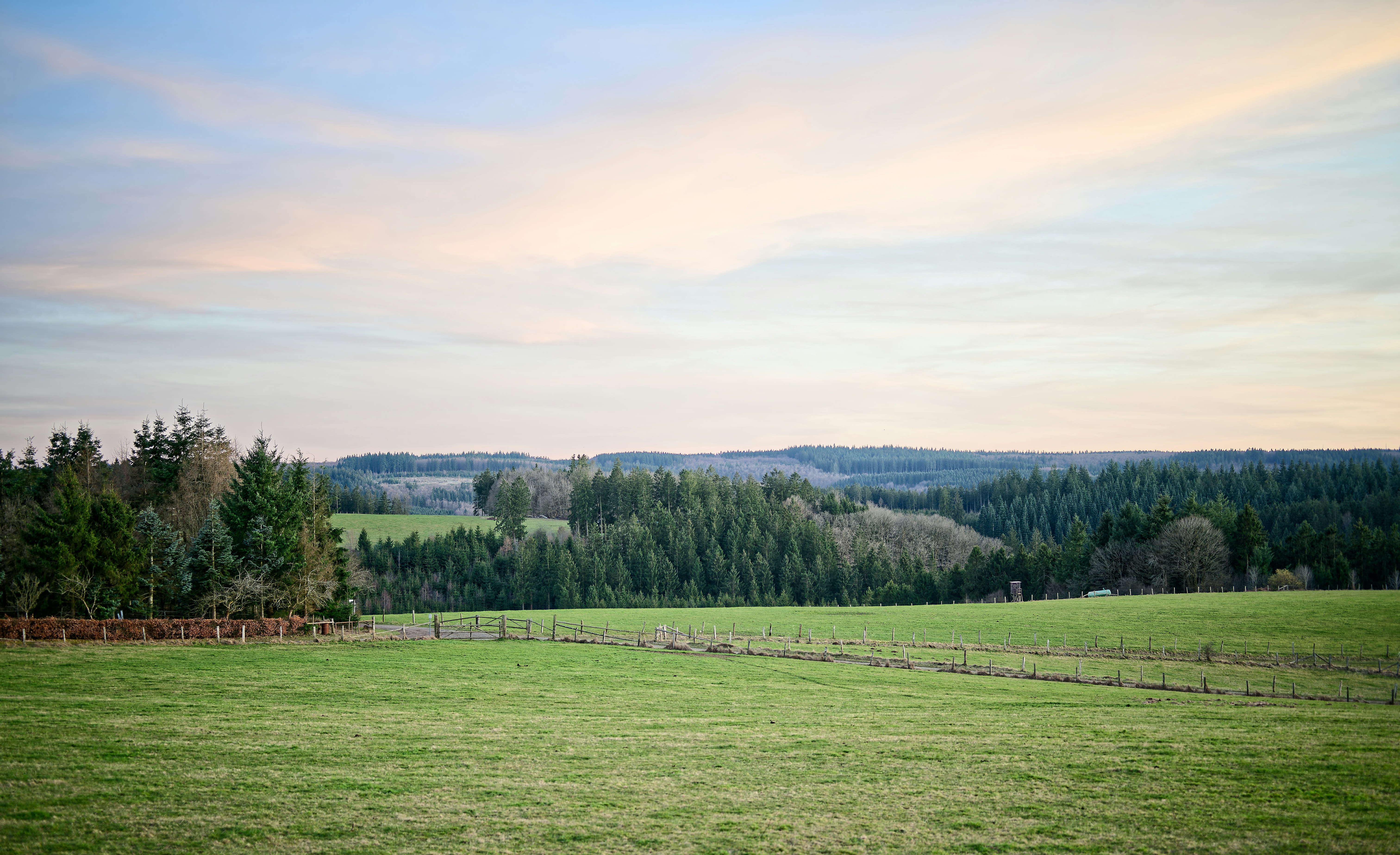 Pastoral Horizon: Dusk Over a Quiet Valley