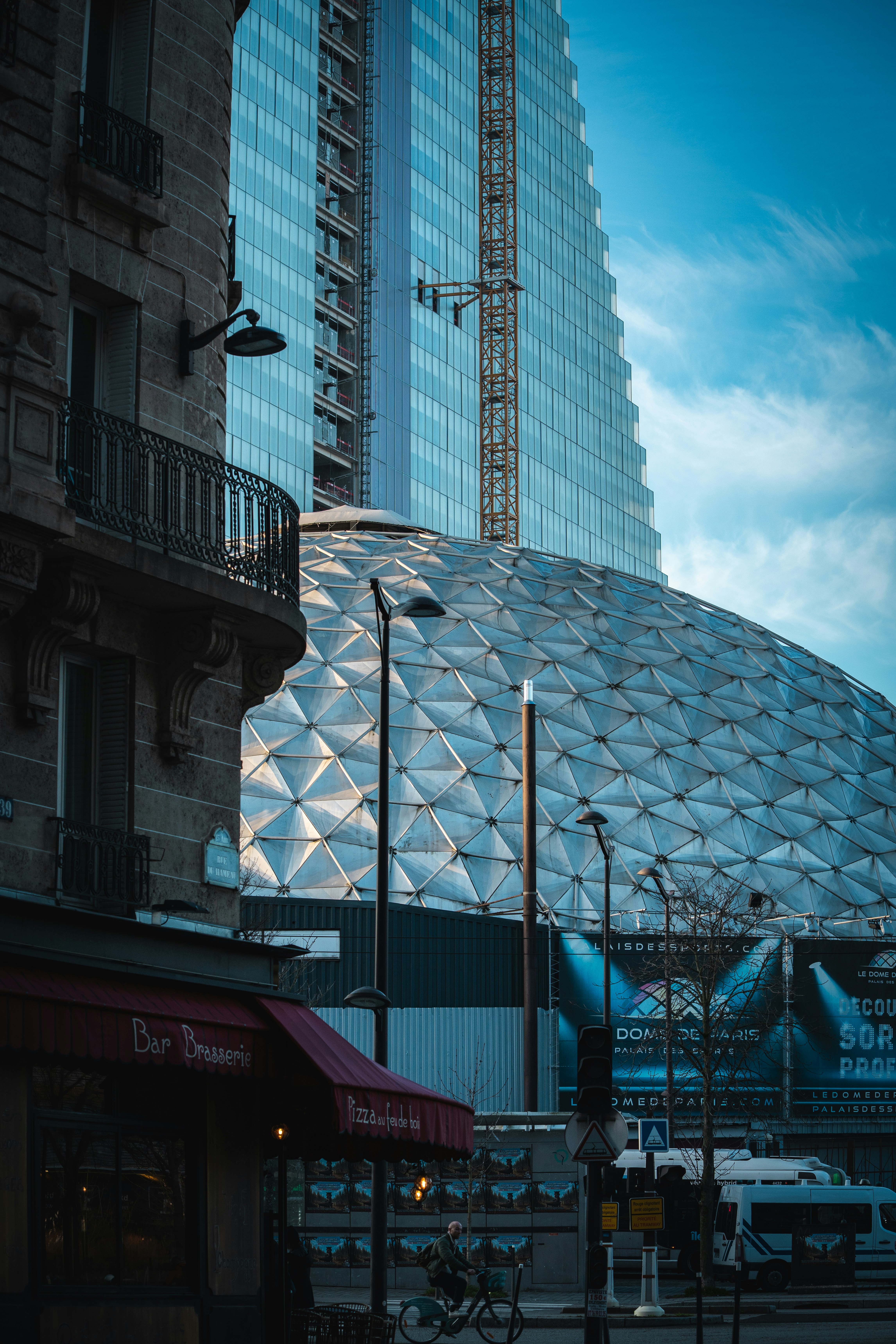 Geometric Dome Meets Historic Facades in Urban Sunset