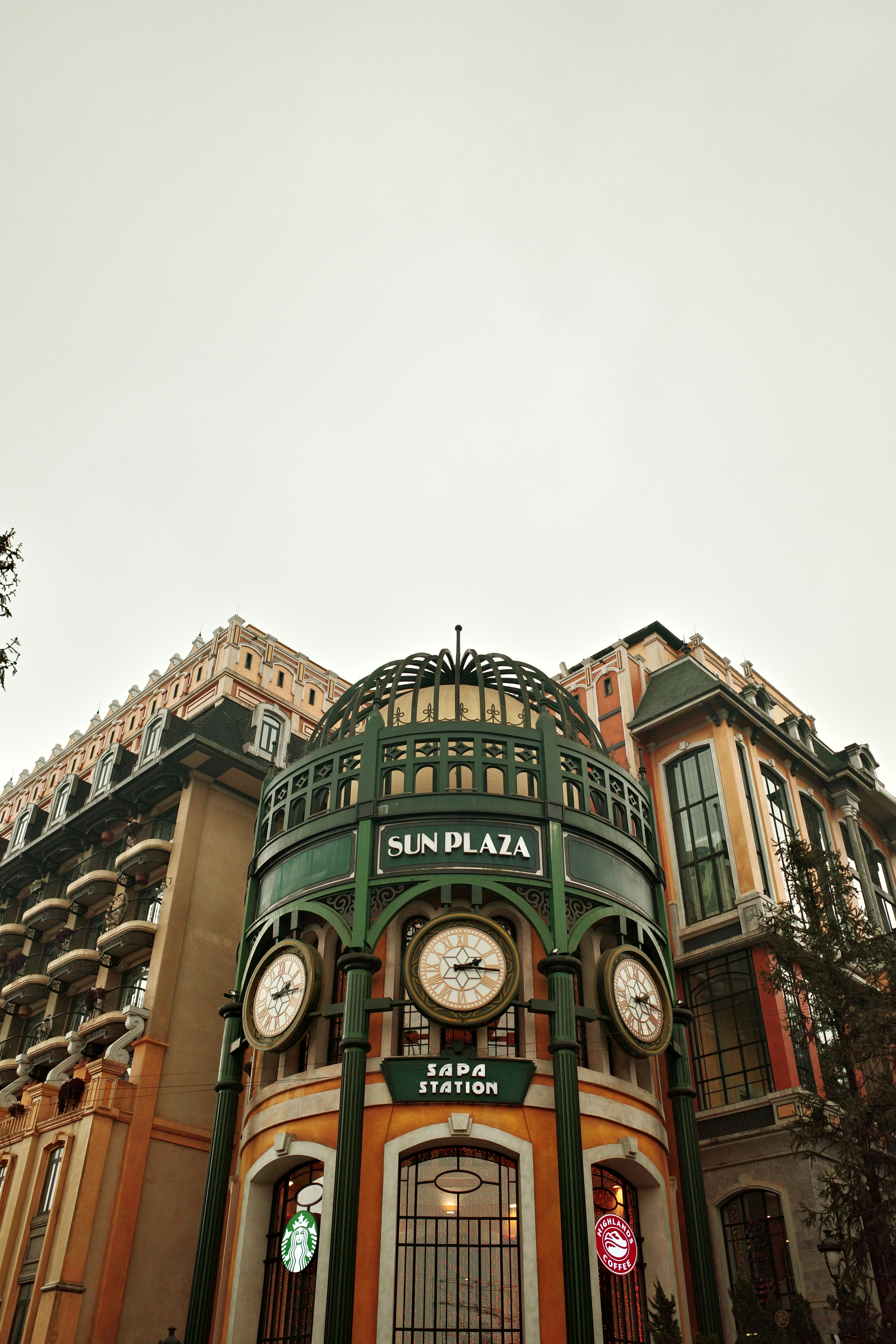 Green Clock Tower at Sun Plaza: An Urban Chest of Time