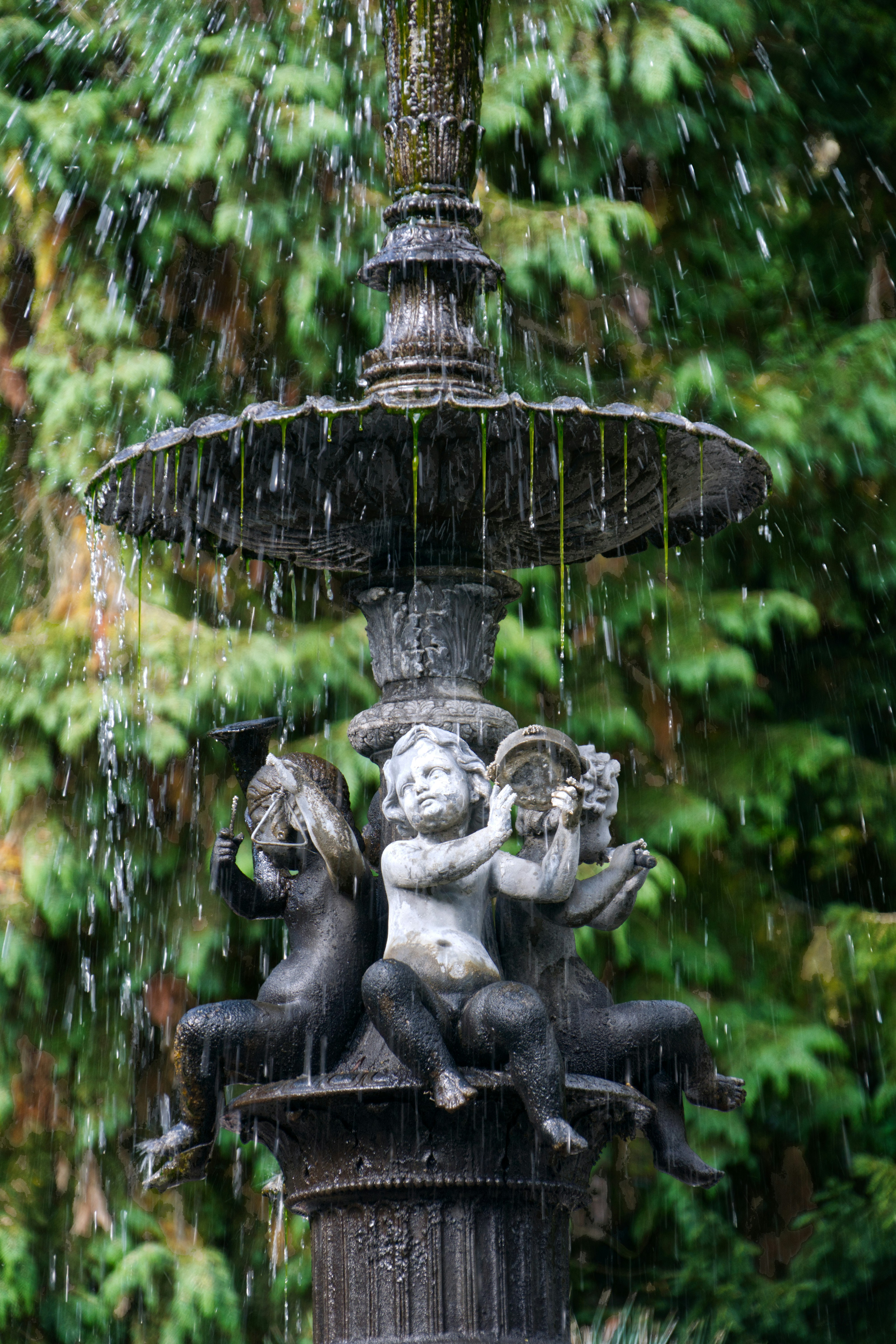 Shot of An Antique Cherub Fountain in Rain