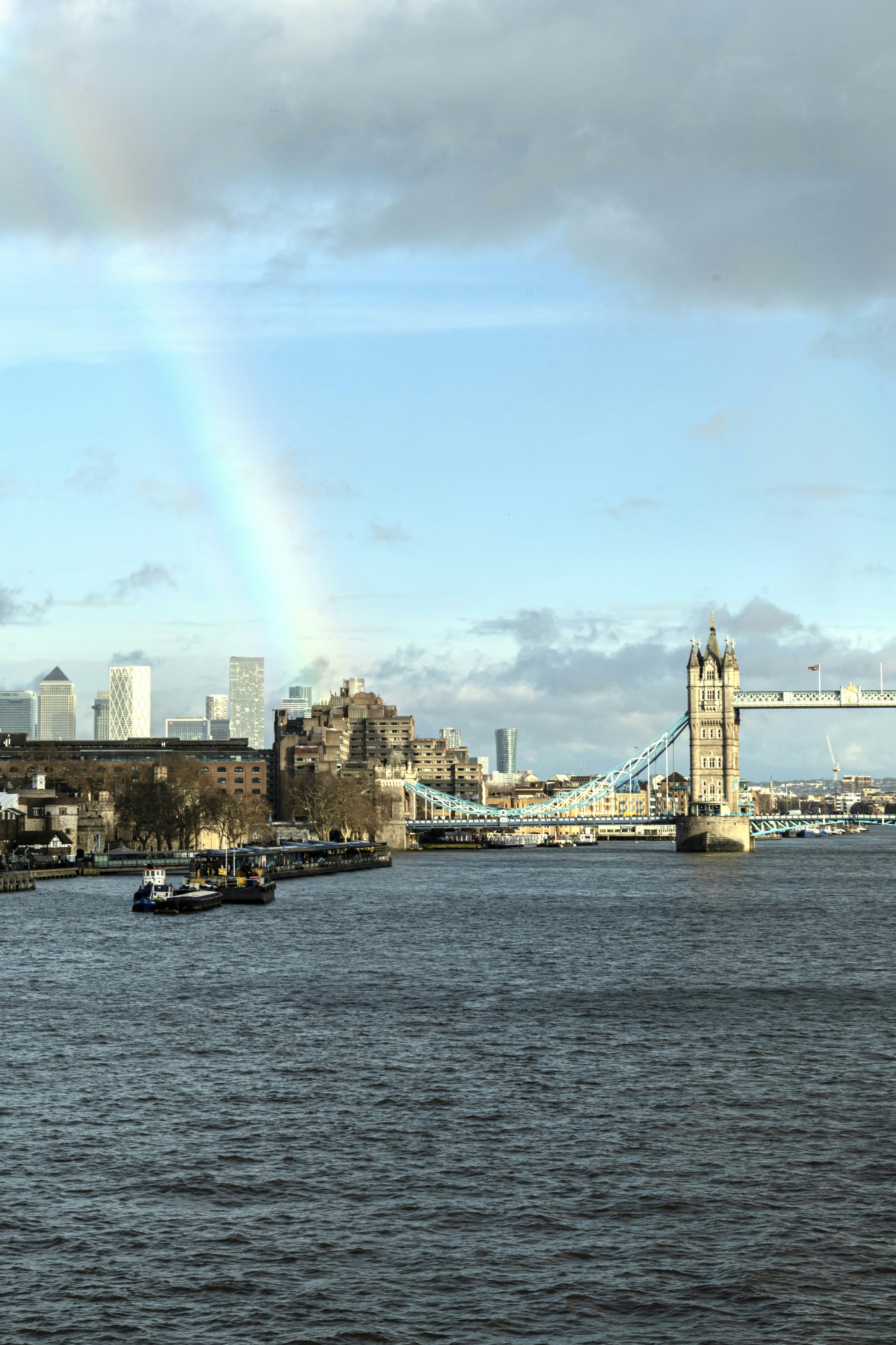 Rainbow over the Thames: Tower Bridge lit by late-day light