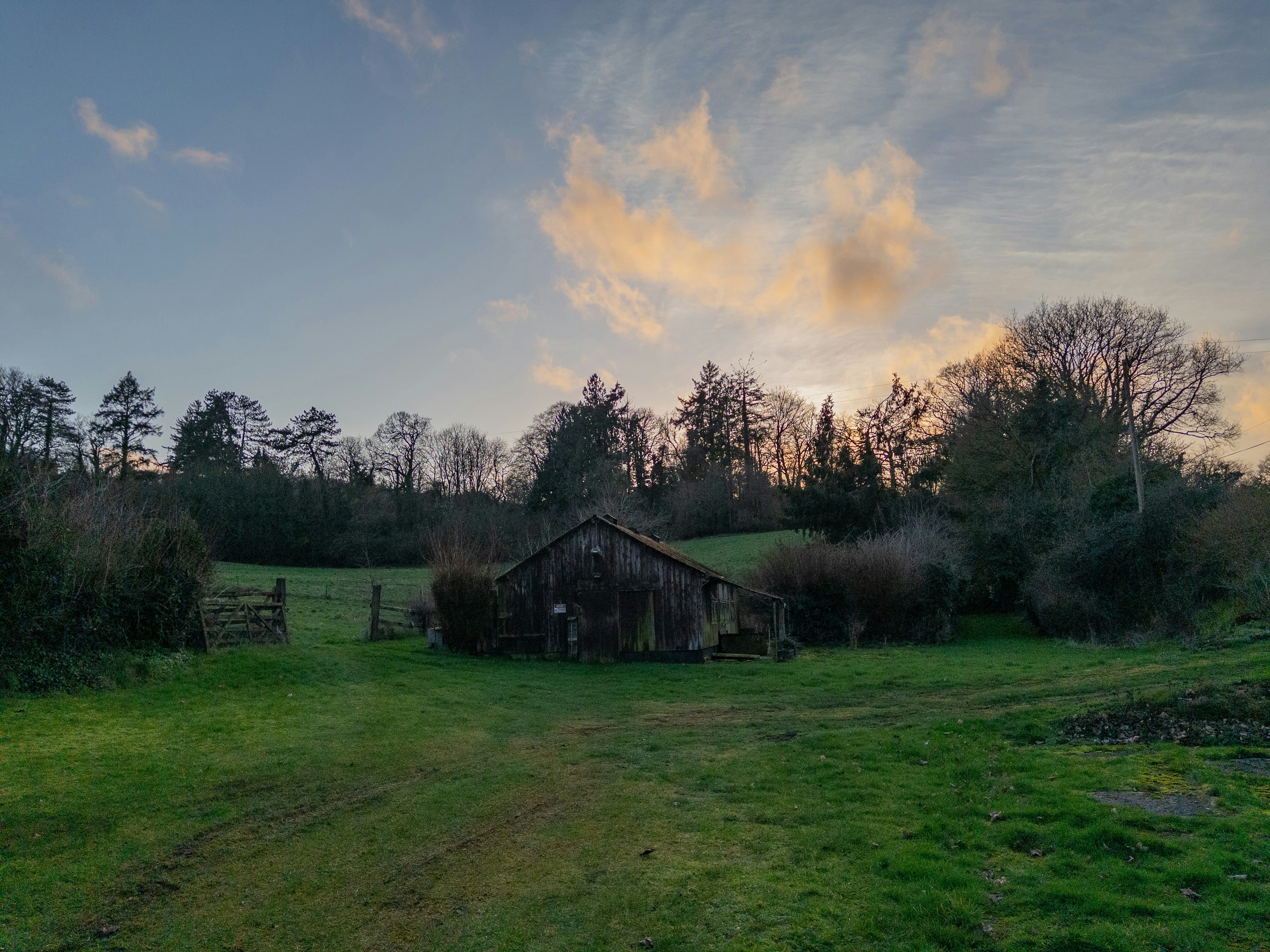 Sunlit Farmstead Beneath a Velvet Evening Sky