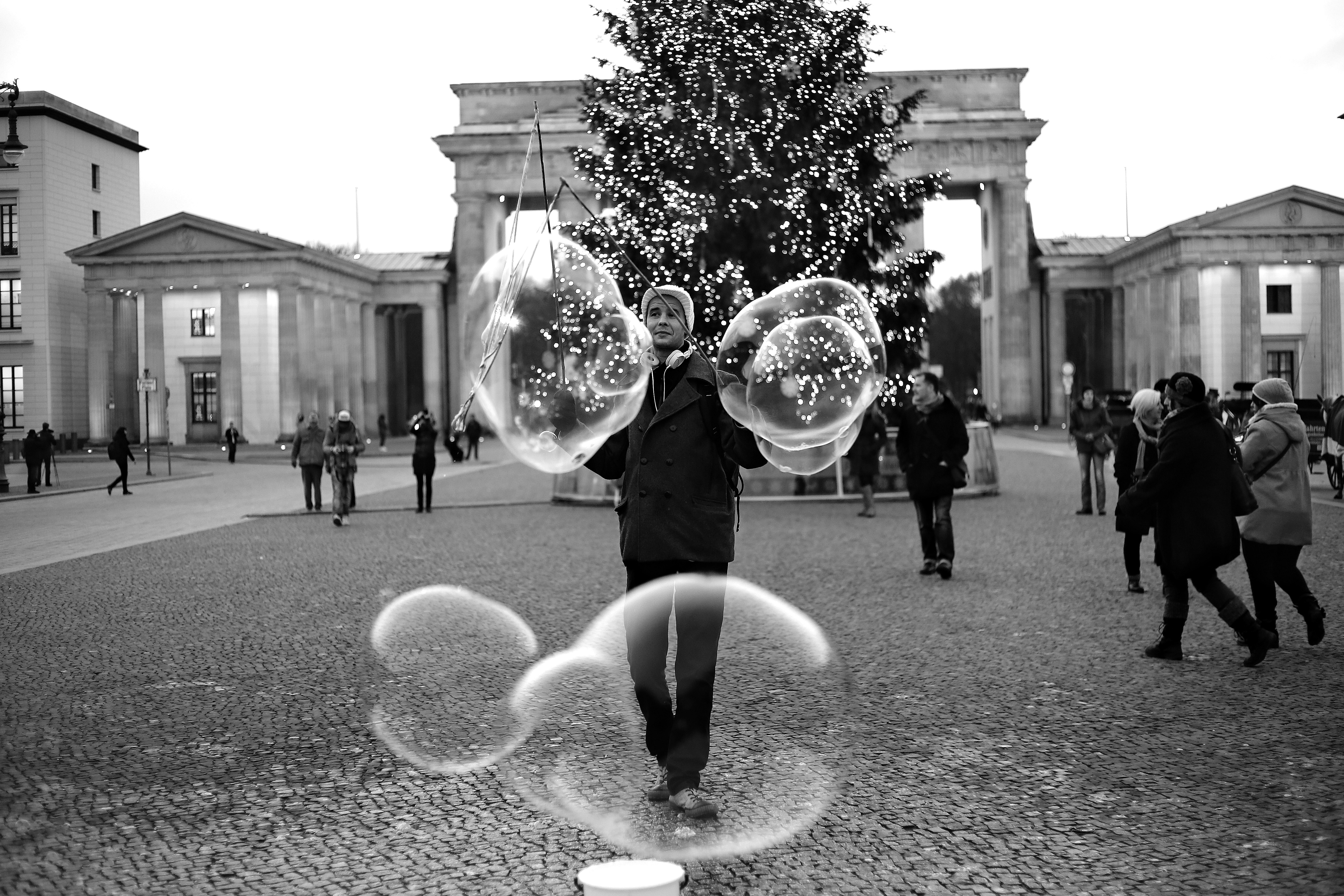 Bubble Artist in Front of a Grand Monument