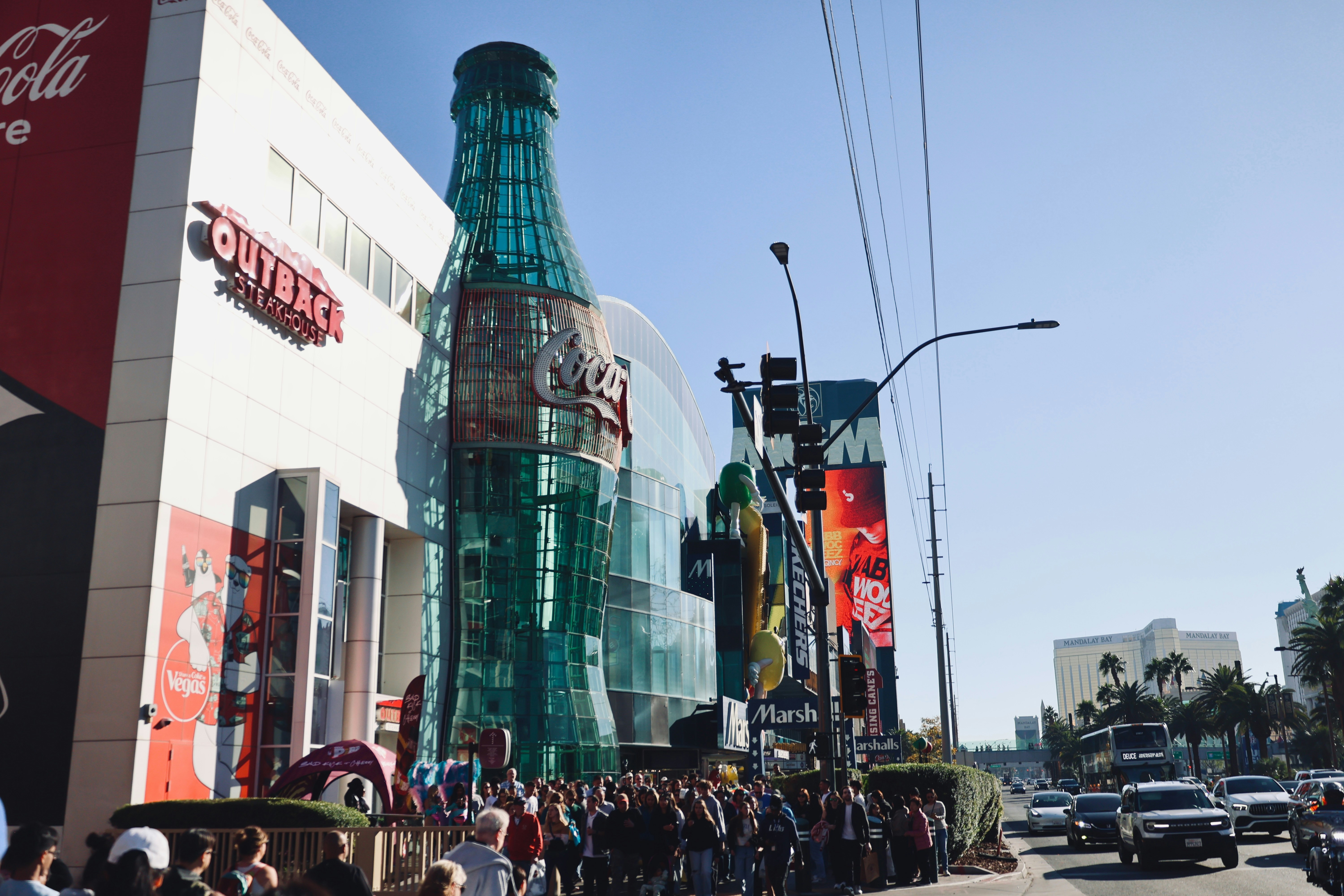 Neon Green Coca-Cola Tower Heats Up a Busy Hollywood Boulevard