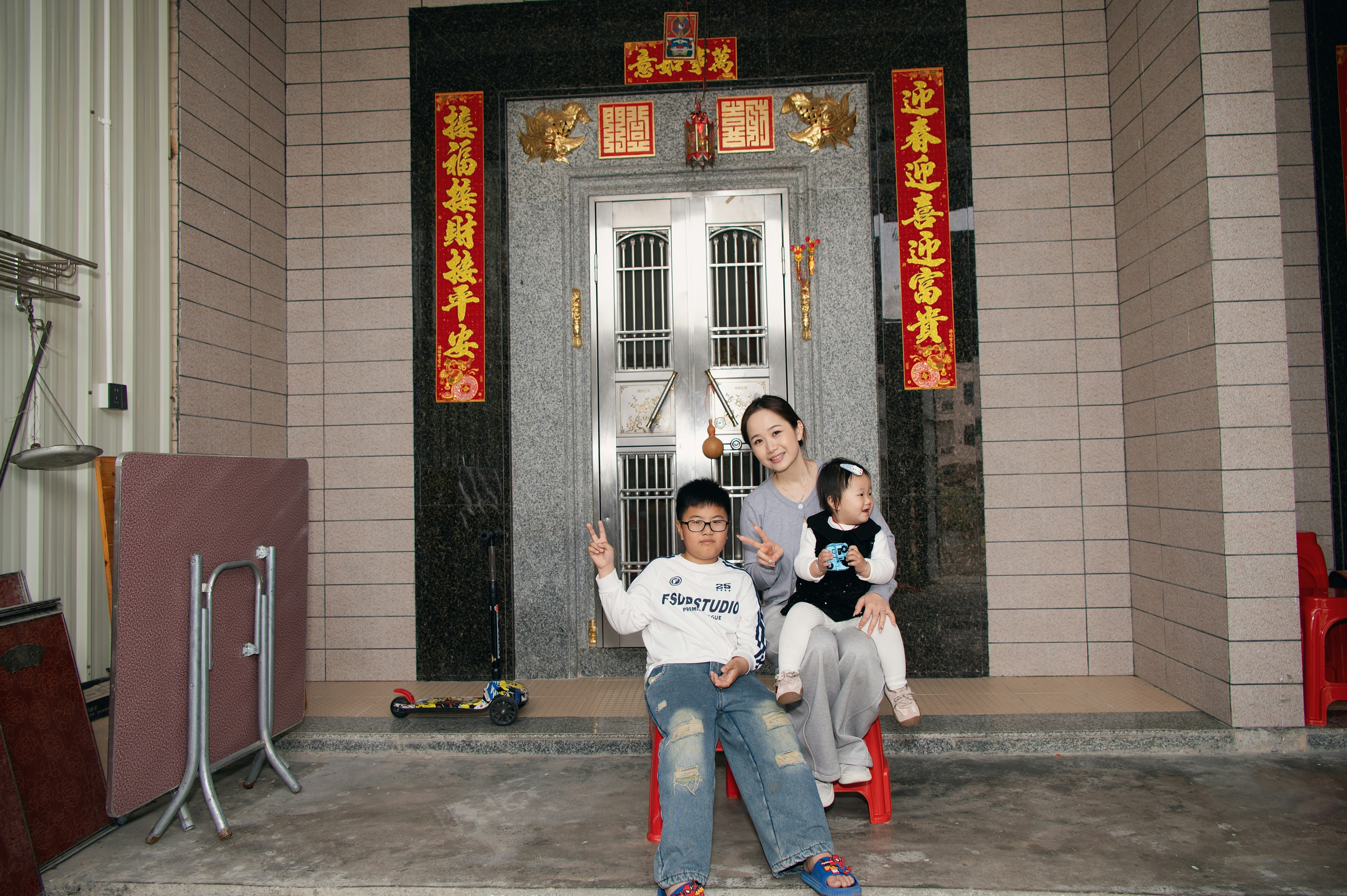 Family Portrait on a Temple Step: Quiet Bond in a Shrine Entrance