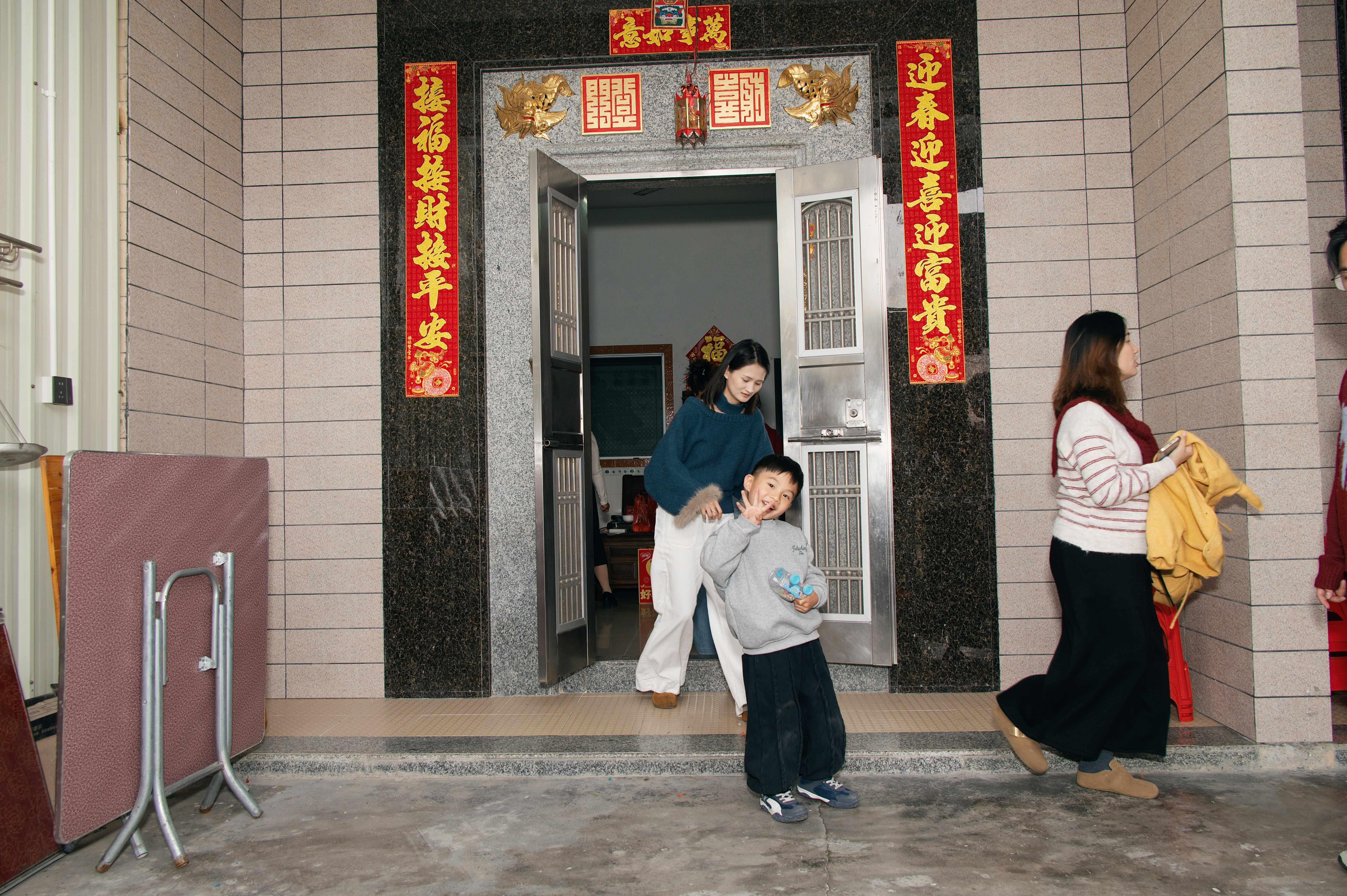 Doorway of Echoes: A Family Pause at a Temple Entrance