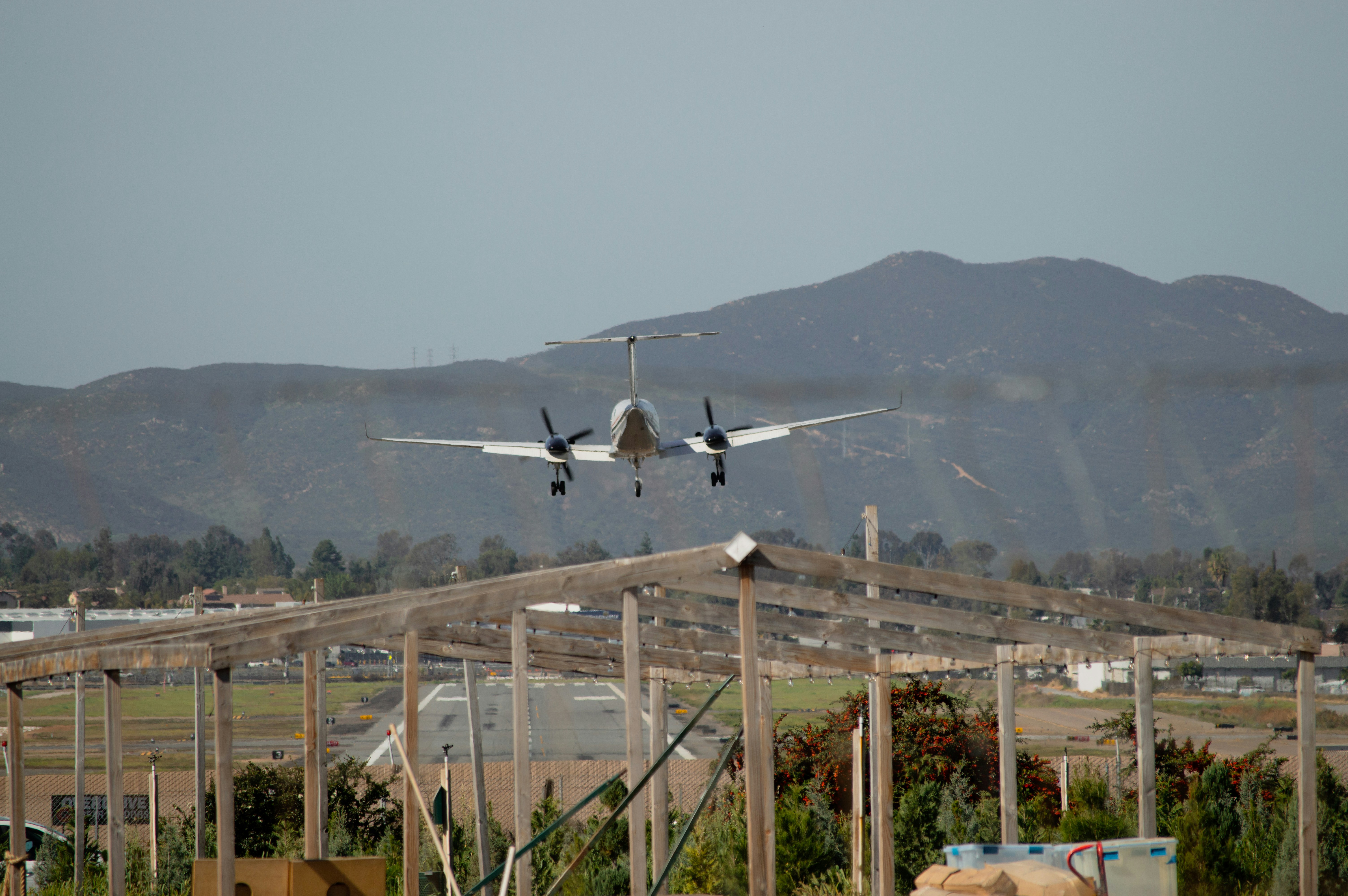 Landing Approach: Taildragger Descent Over a Trellis of Structures