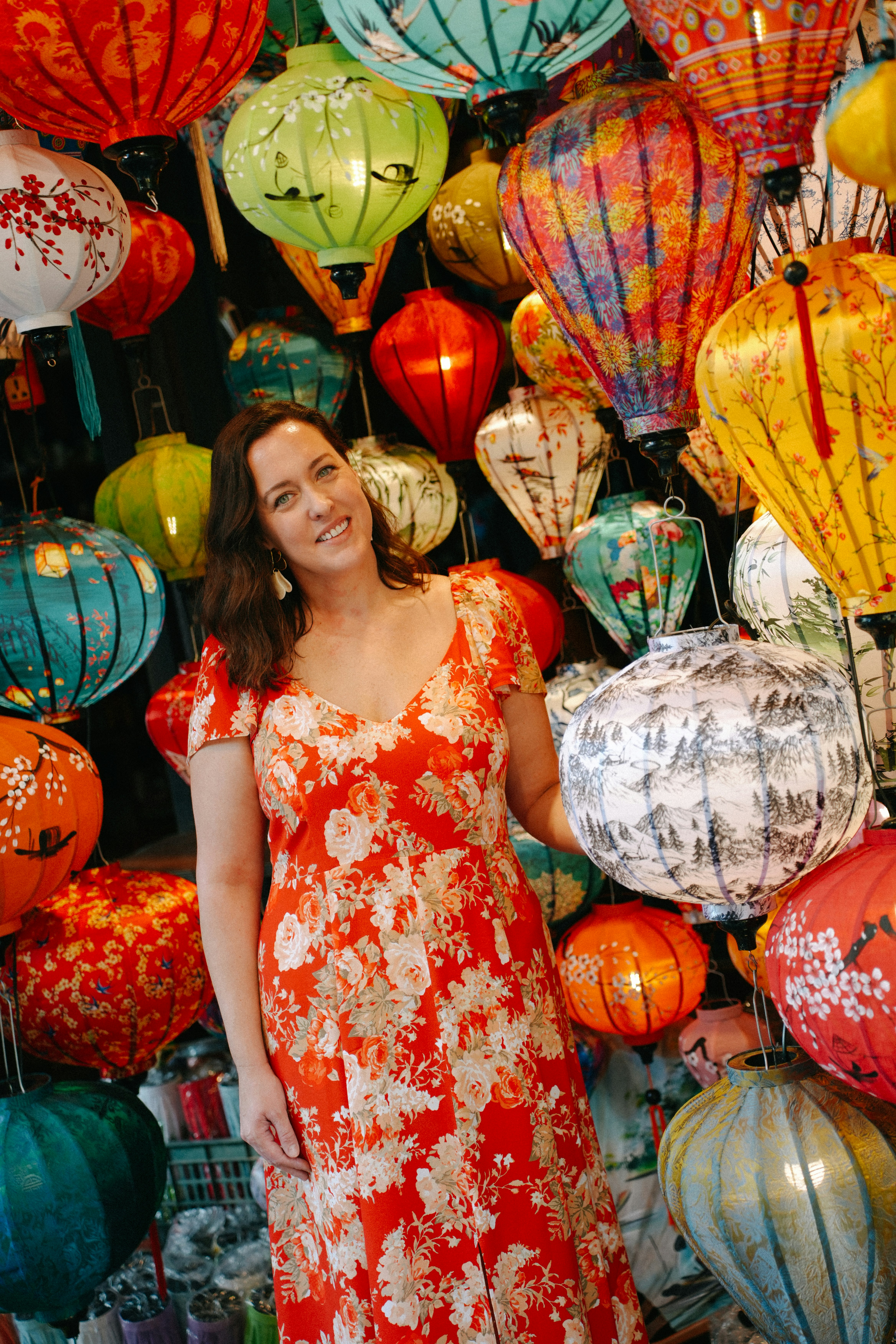 Red Floral Dress Among Floating Lanterns