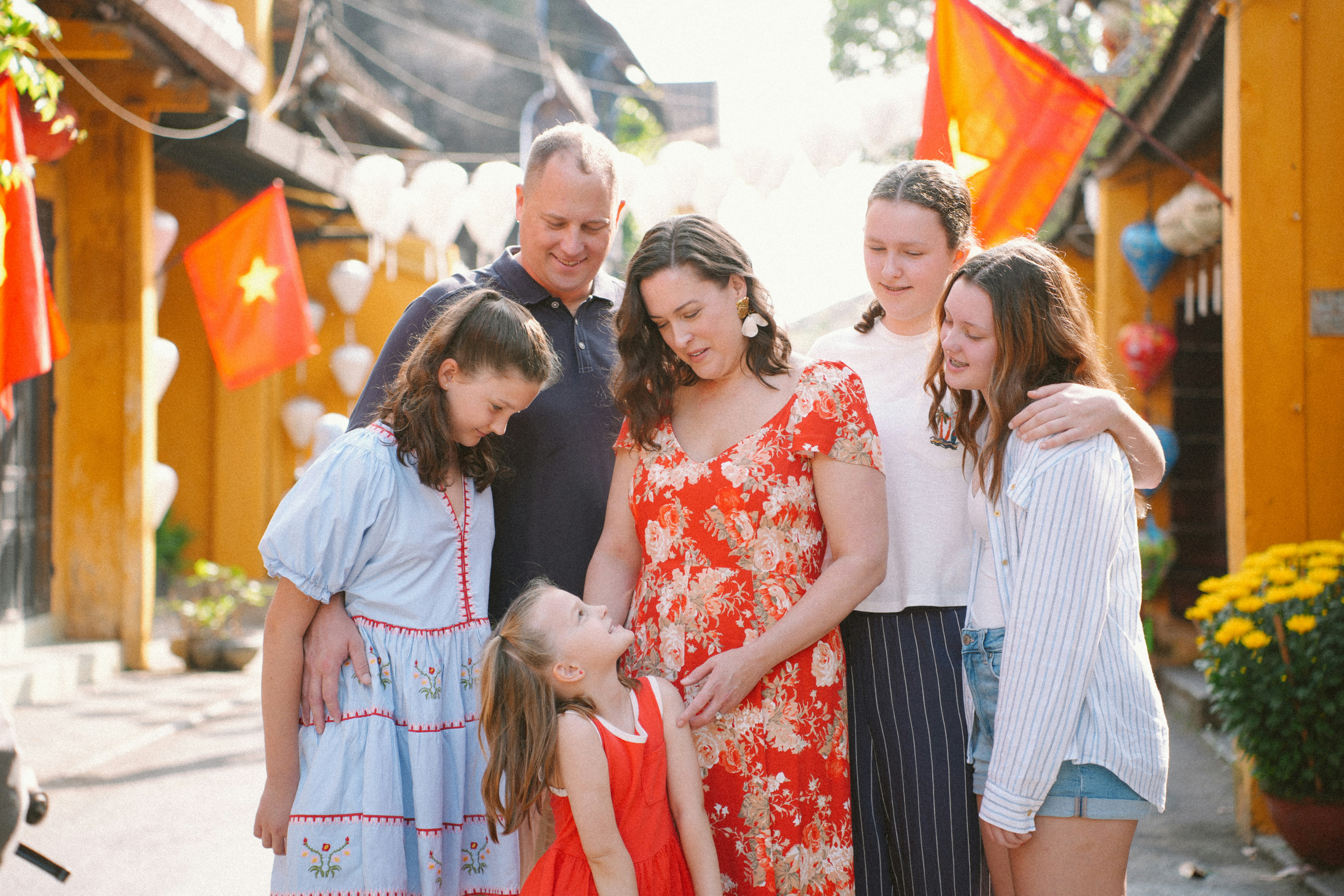 Sunlit Family Moments in a Festive Village