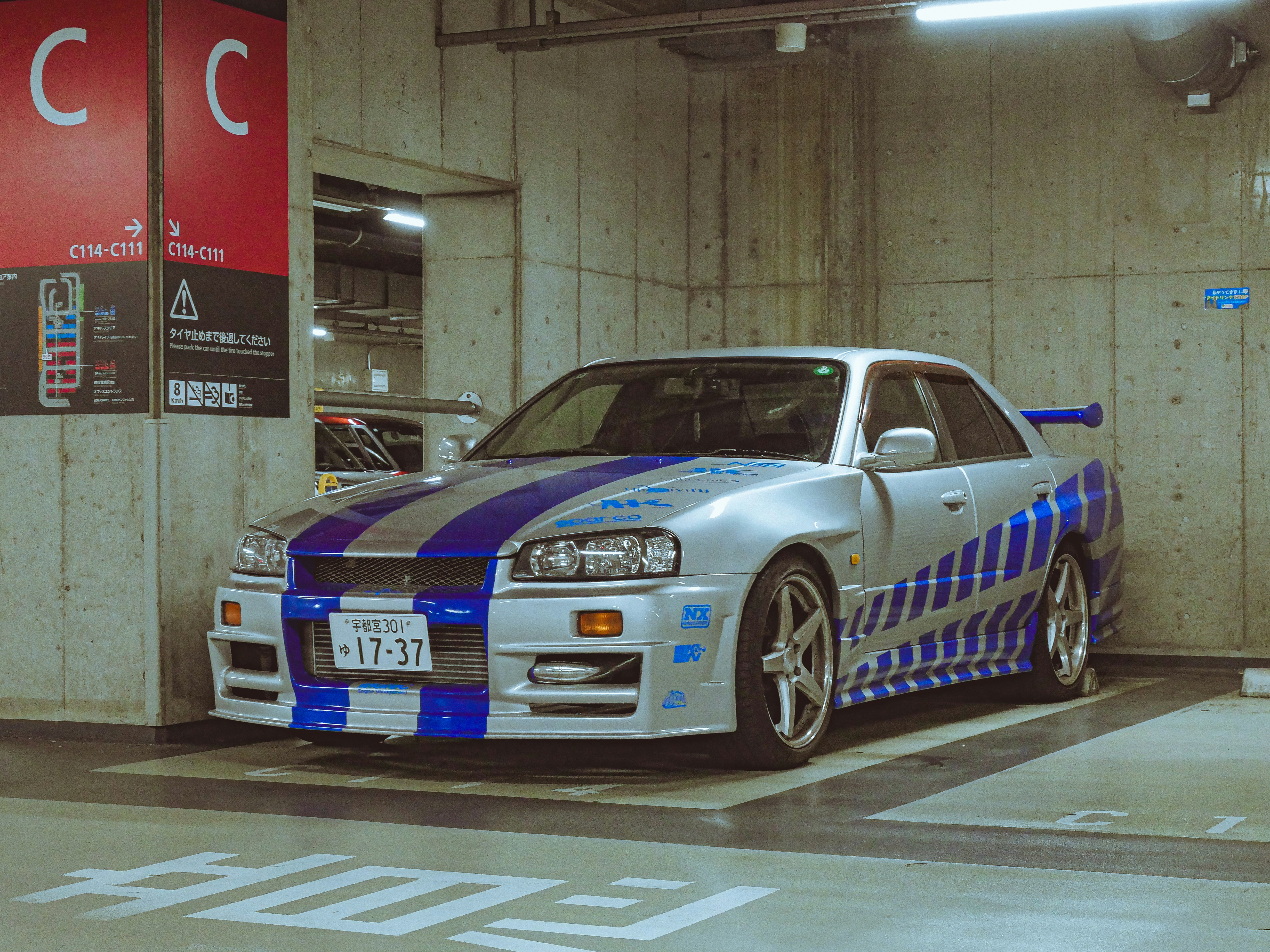 Blue racing stripes: A silver skyline stables in an underground garage