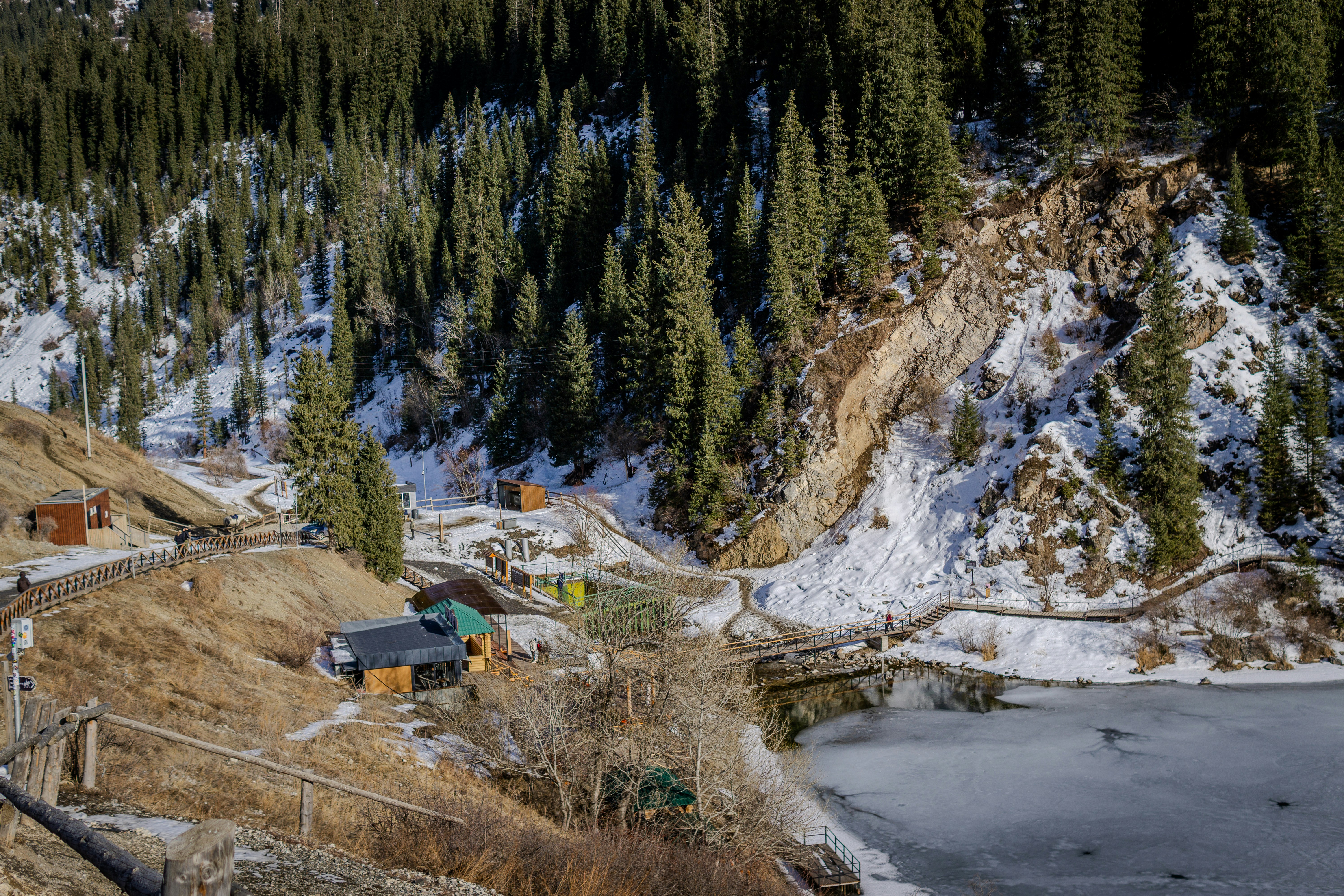 Snowbound Lakeside Haven: Cabins Nestled by Frosted Pines