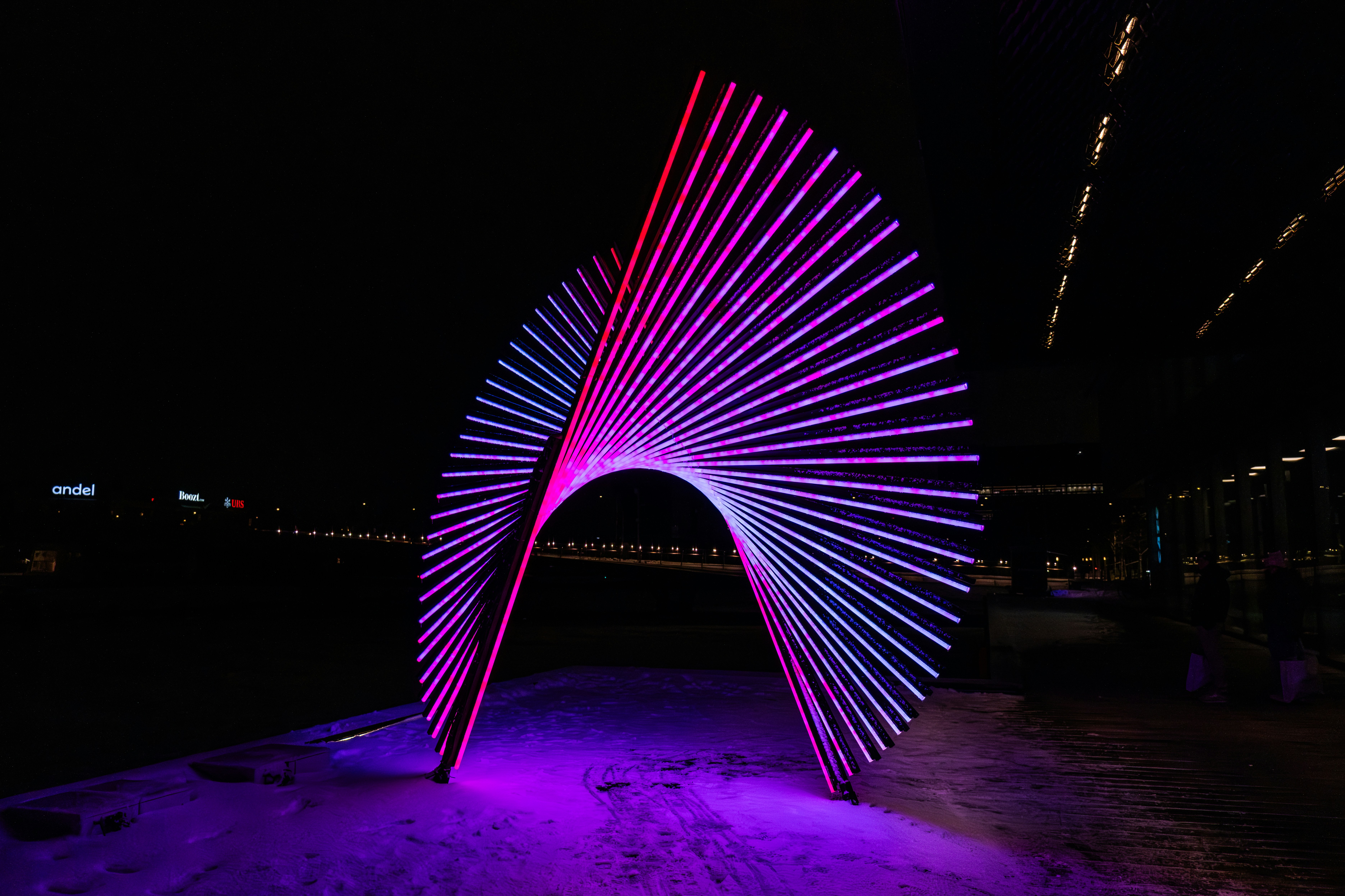 Neon Arc: A Spiral of Light on the Night Beach