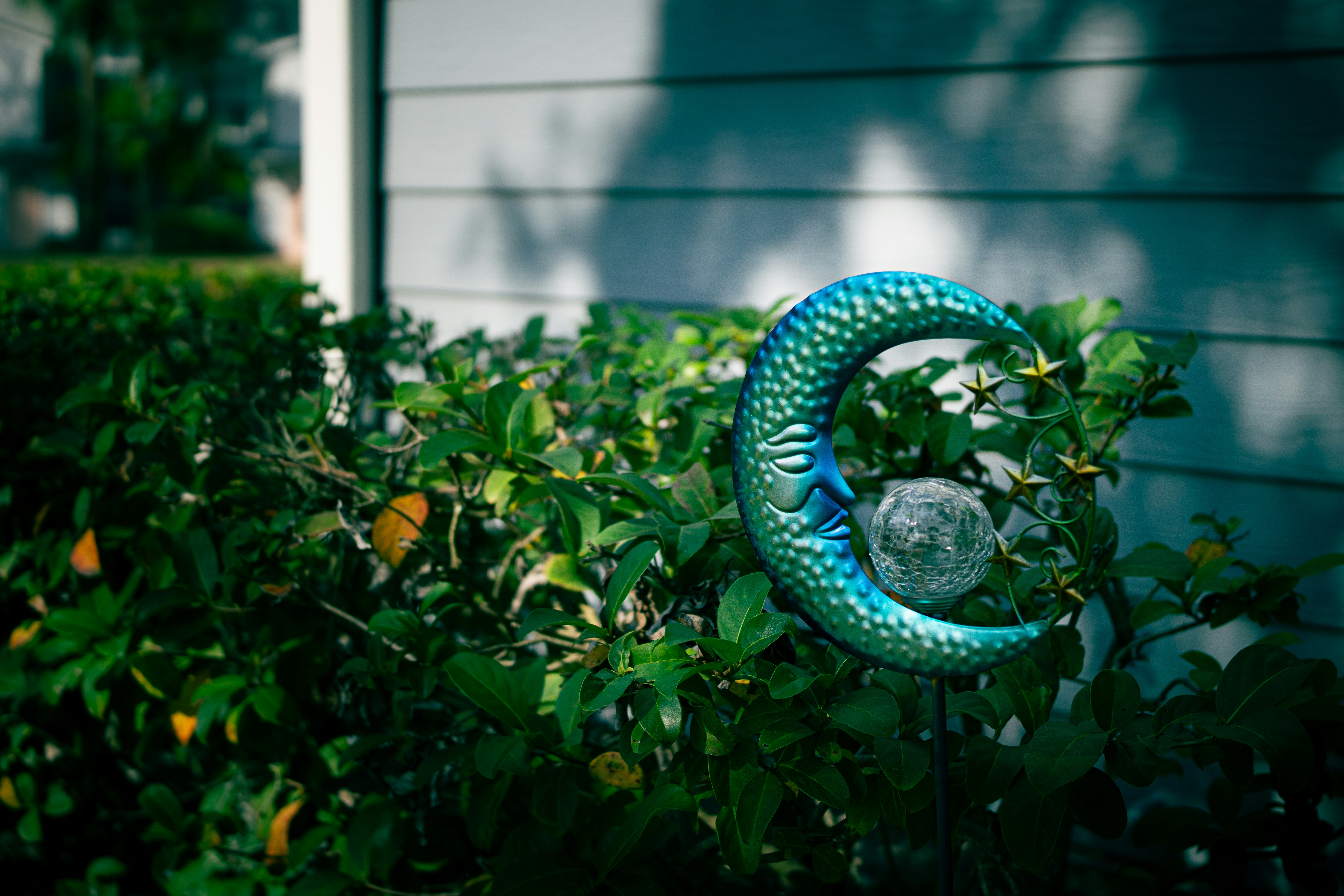 Crescent Garden Relic: Aqua-emerald Ornament among Tender Shrubs