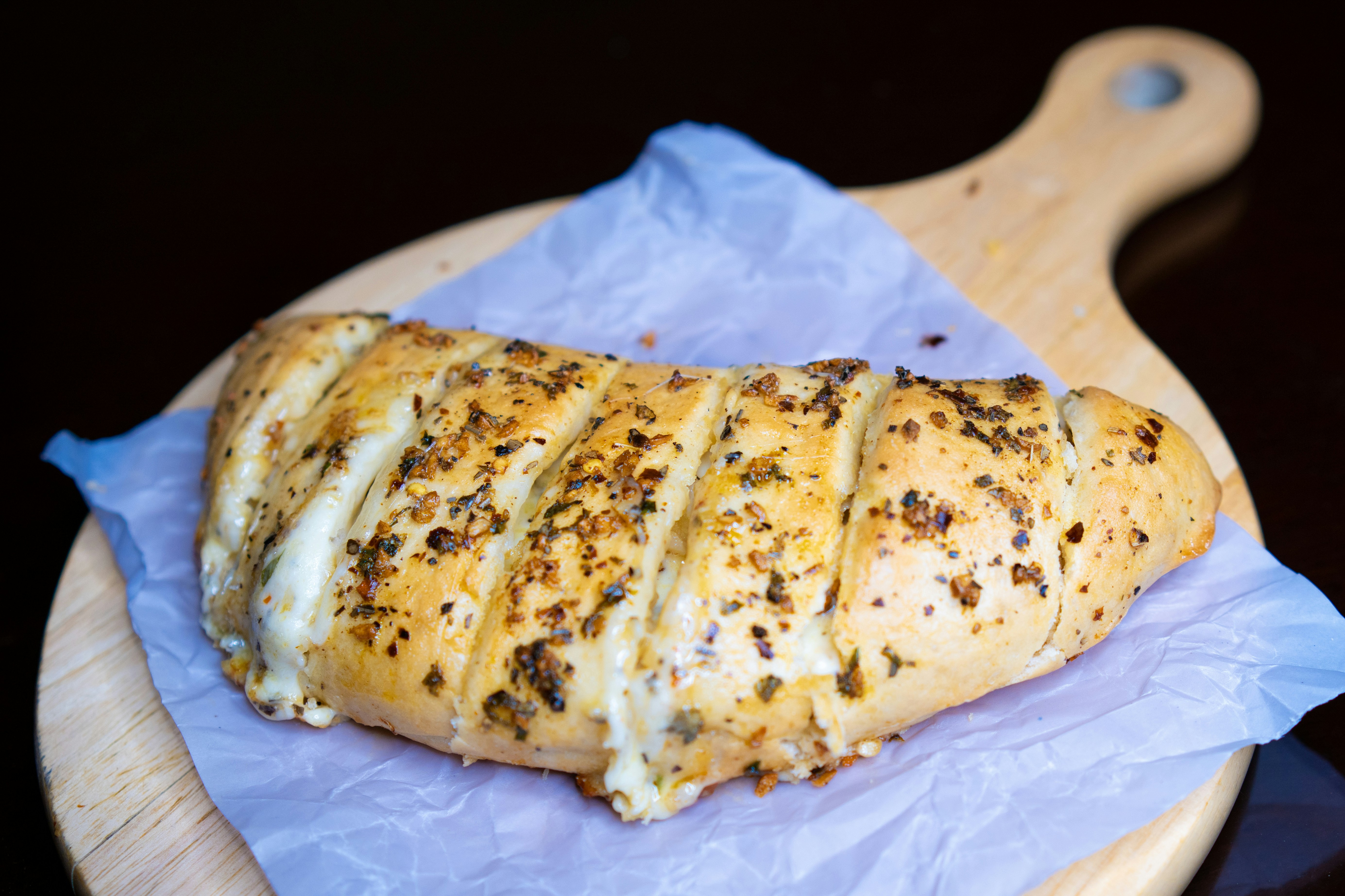 Garlic‑Herb Cheese Swirl Loaf on a Blue-Tinted Paper