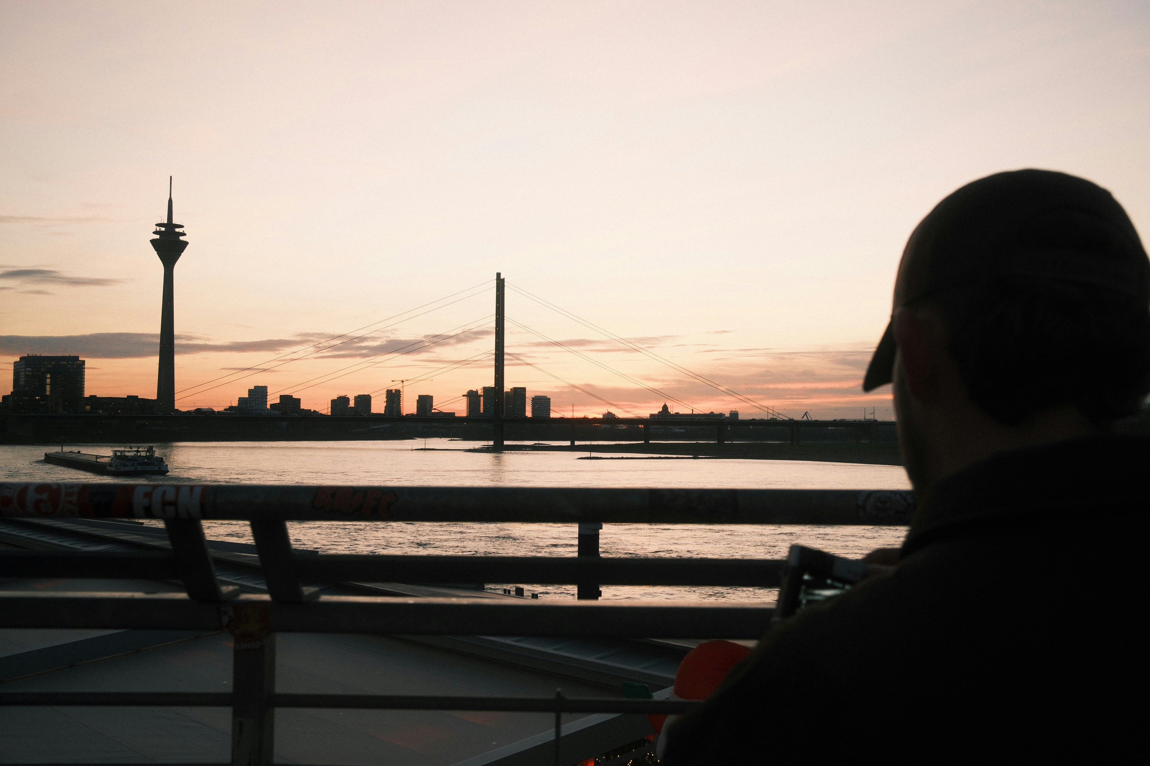 Silhouette at Sunset: Waterfront Skyline from the Quiet Pier
