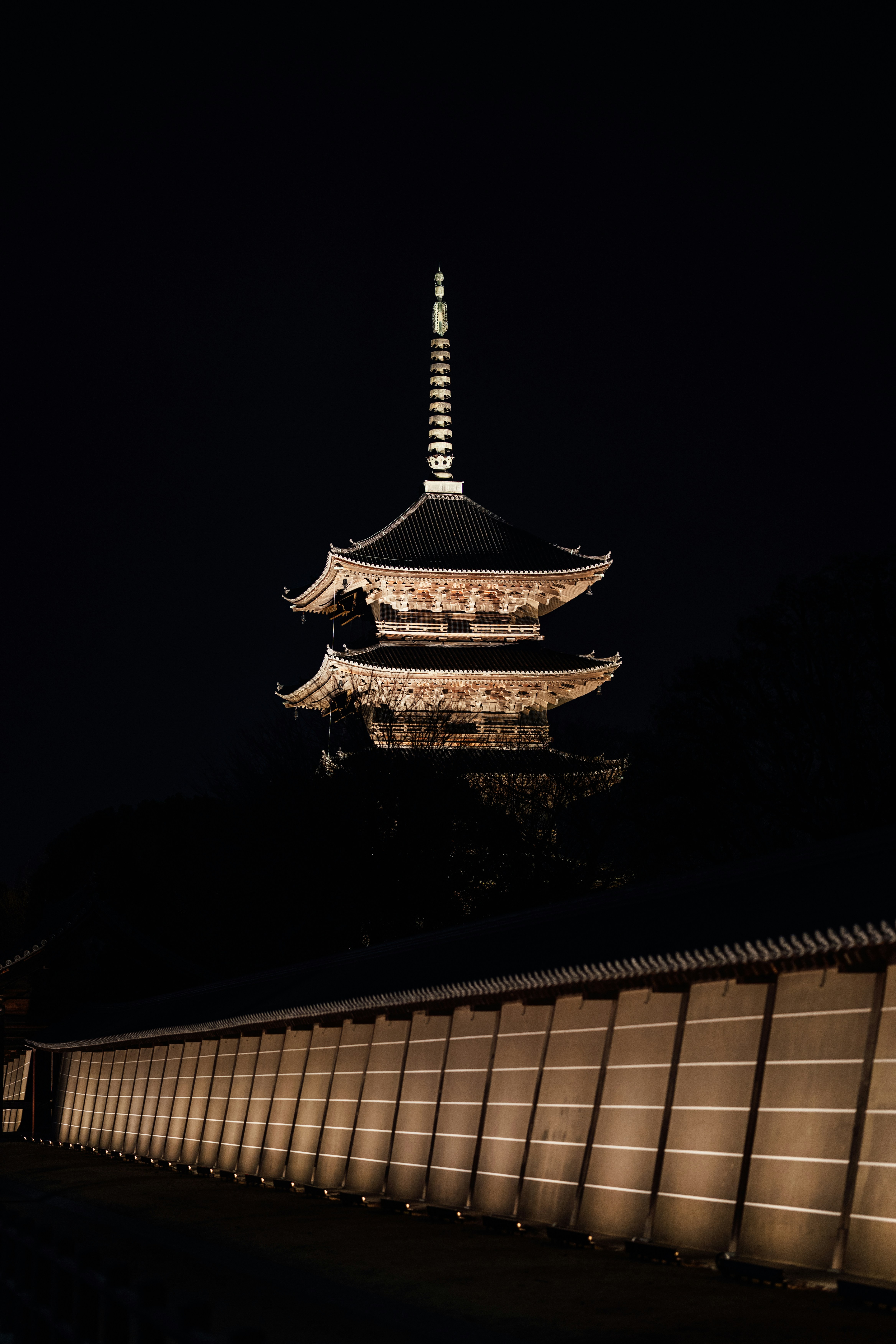 Night Pagoda: A Quiet Torso of Light Over the Wall