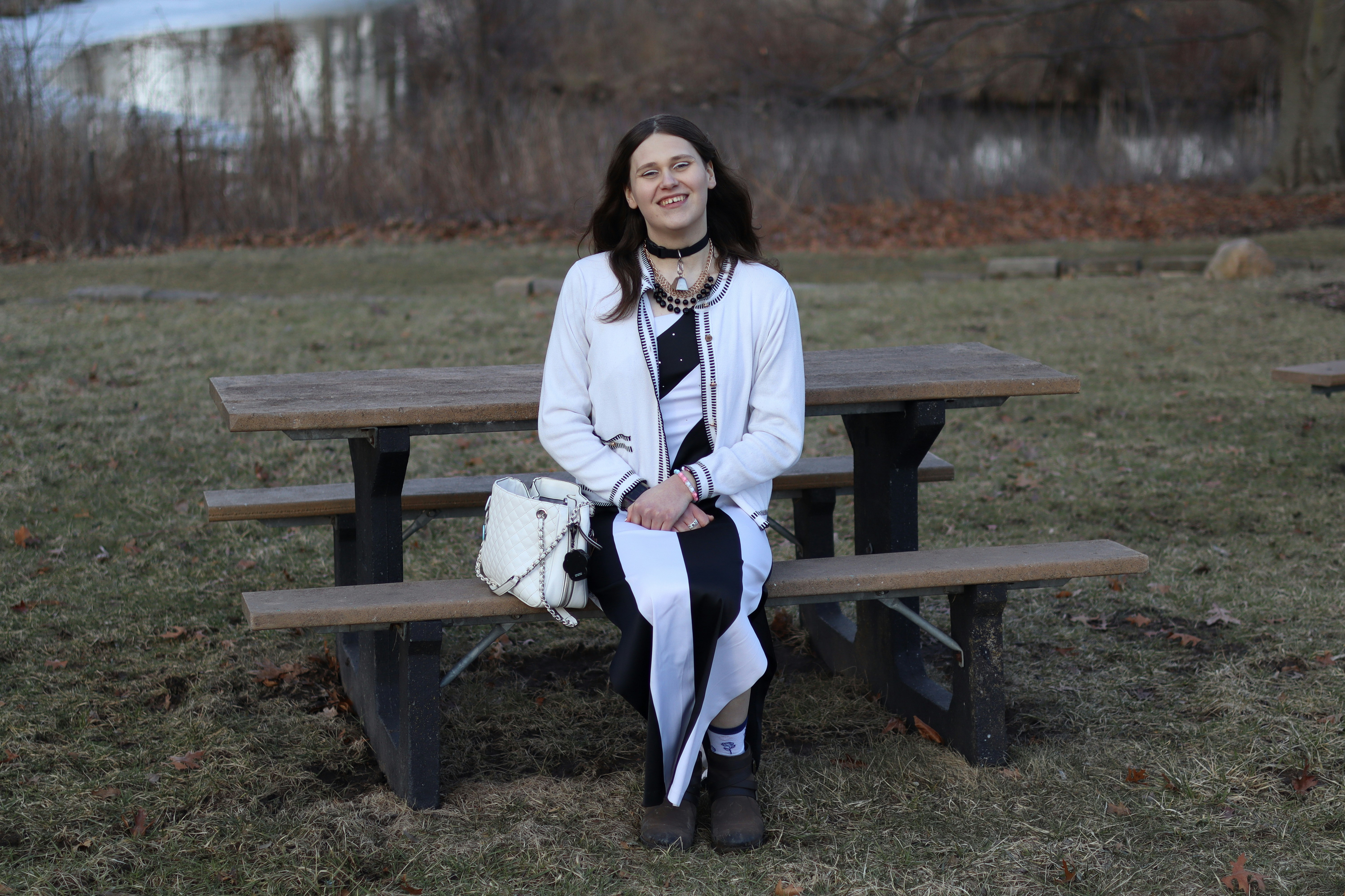 Portrait on a Park Bench: Subtle Confidence in Neutral Tash