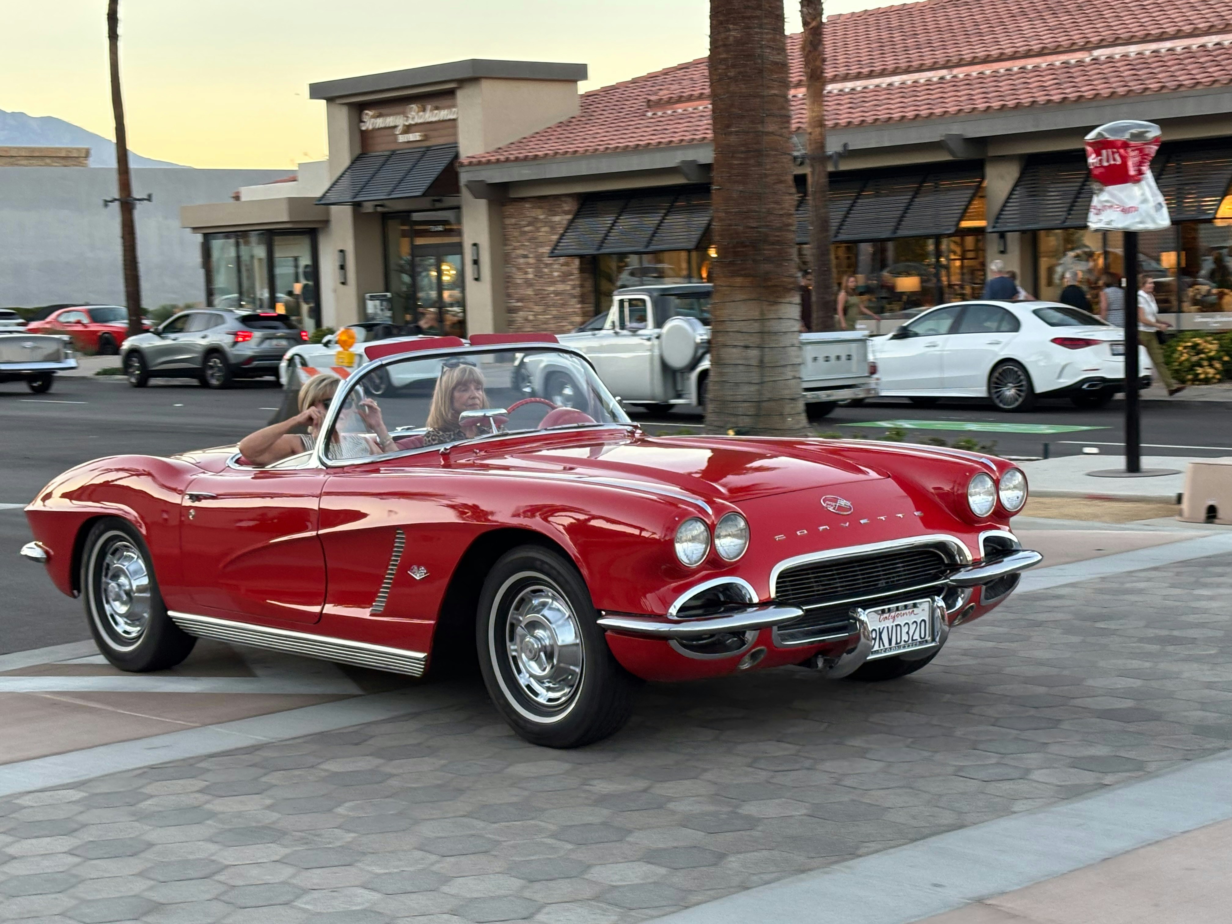 Glossy red Chevrolet Storming Through the Plaza