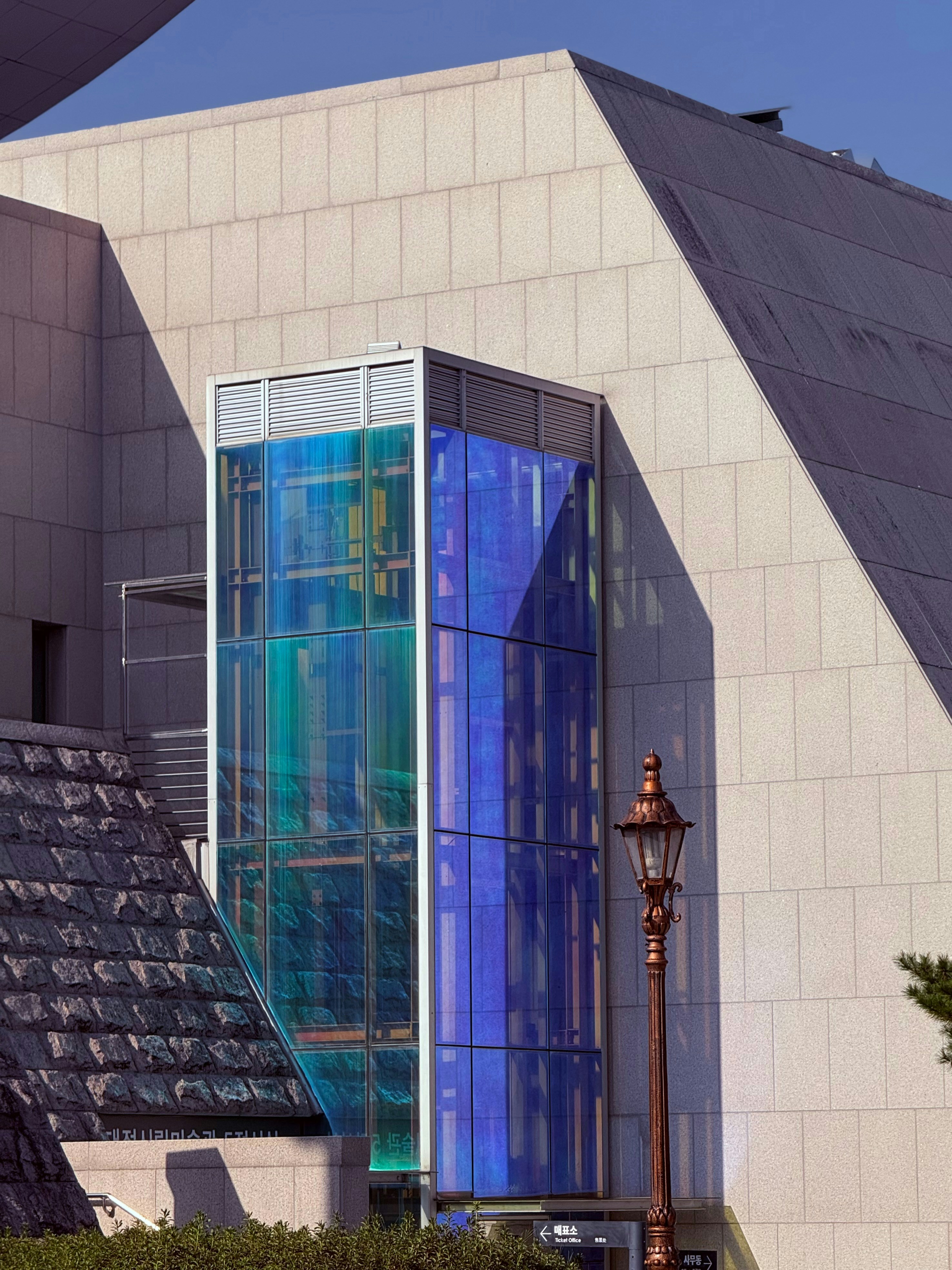 Glass Elevator: A Prism Within a Modern Facade