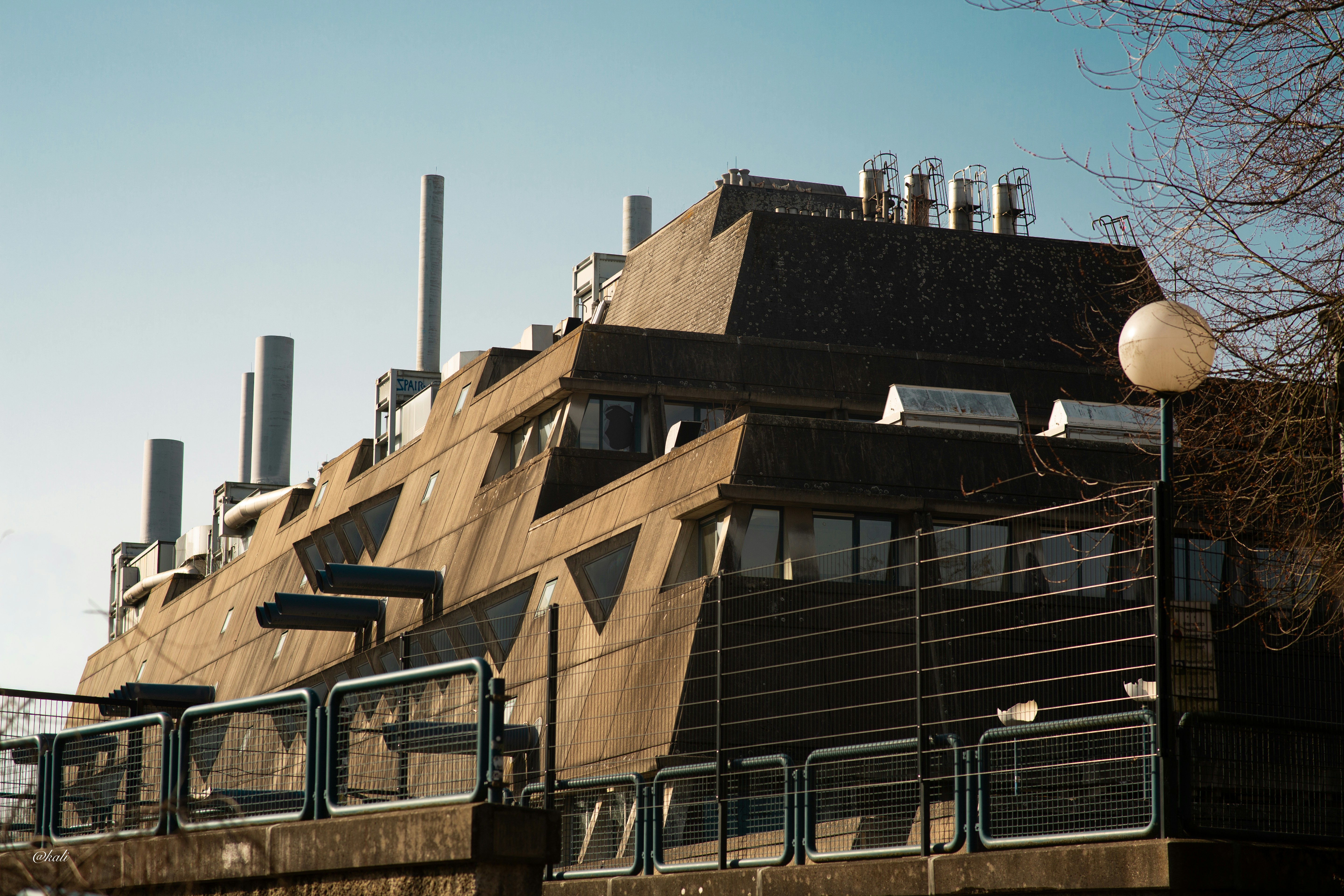 Angular Concrete Facade Under a Clear Sky