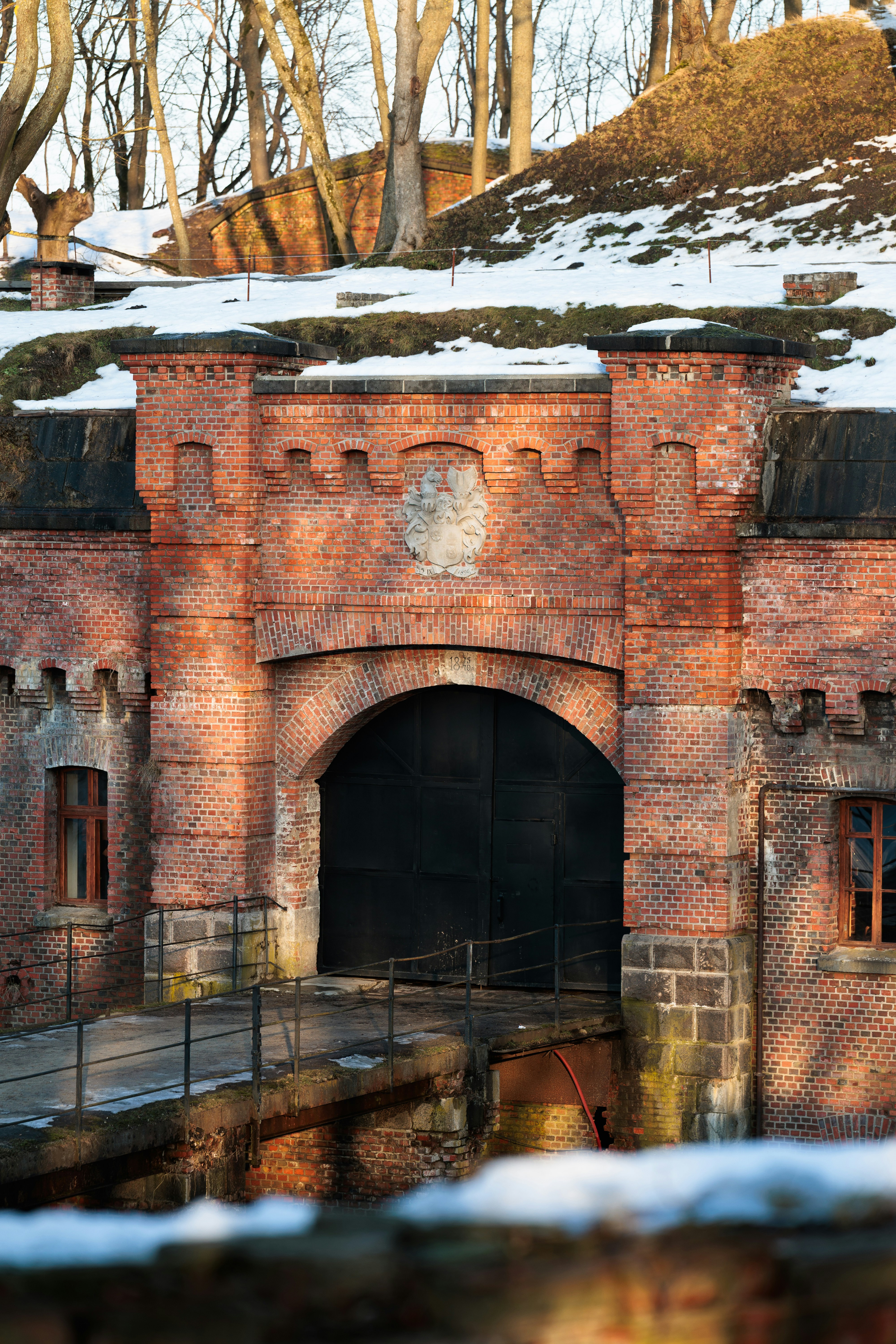 Brick Gatekeeper Under Winter Snow