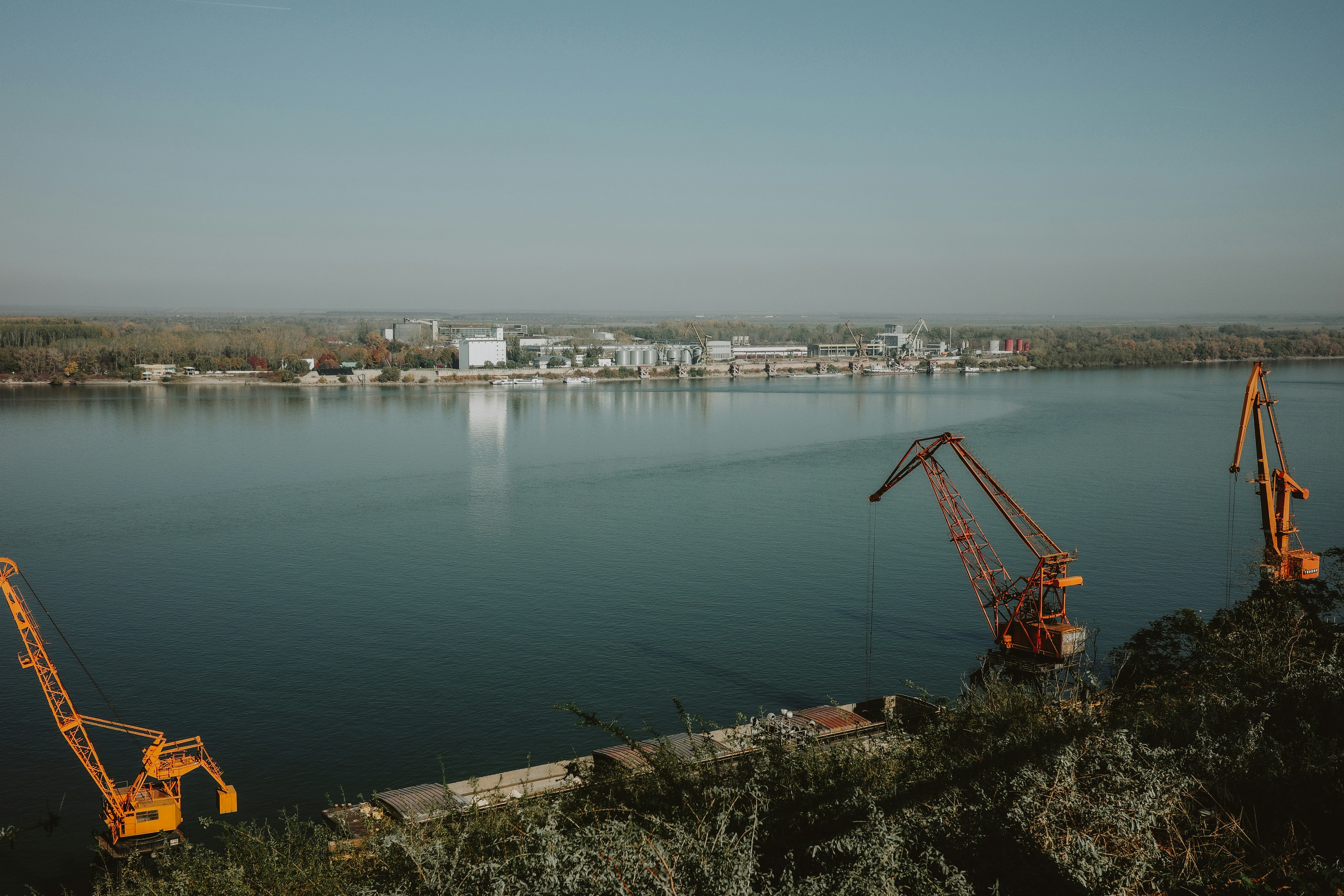 Industrial riverfront in calm dawn light
