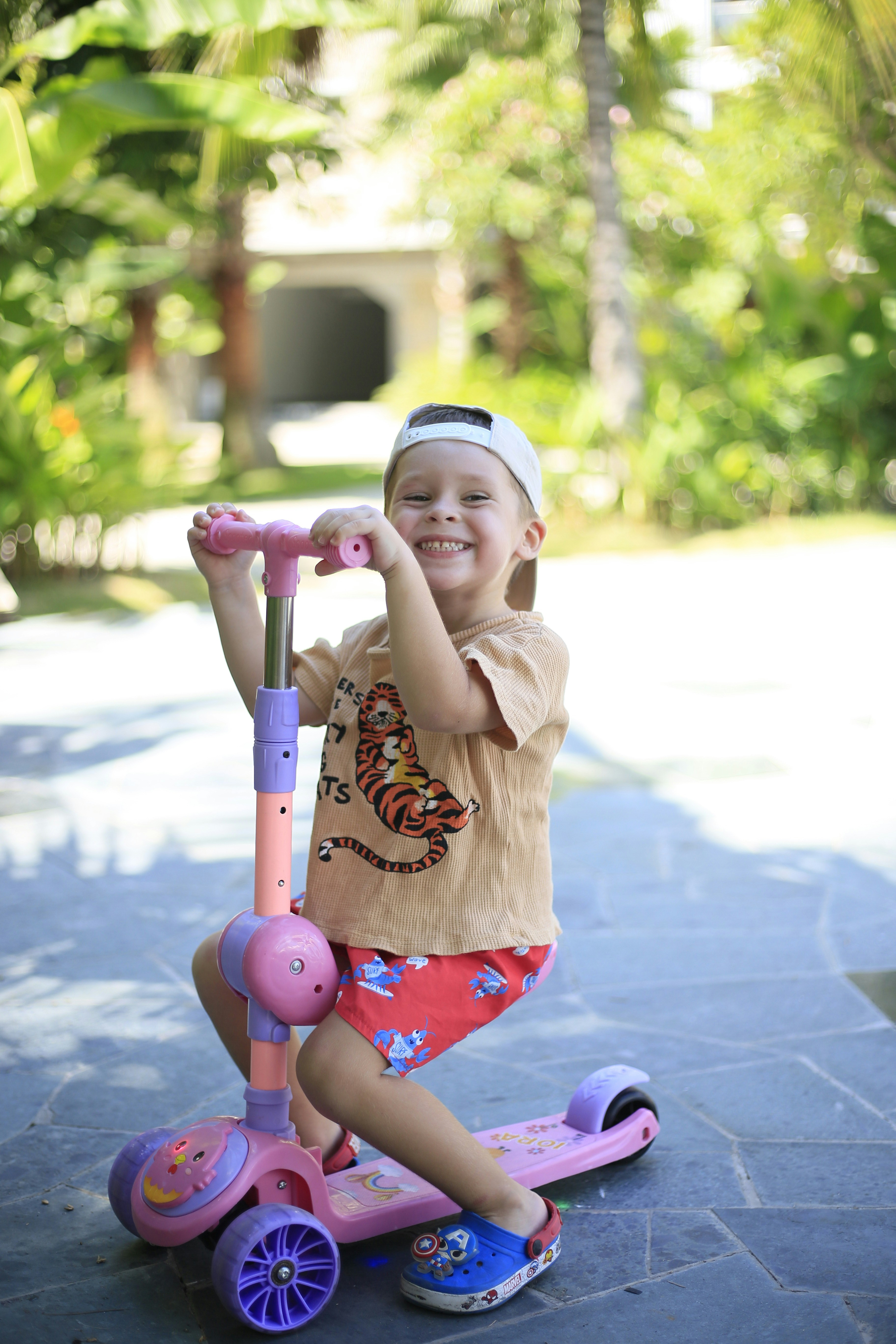Joyful Ride: Little Explorer on a Pink Scooter