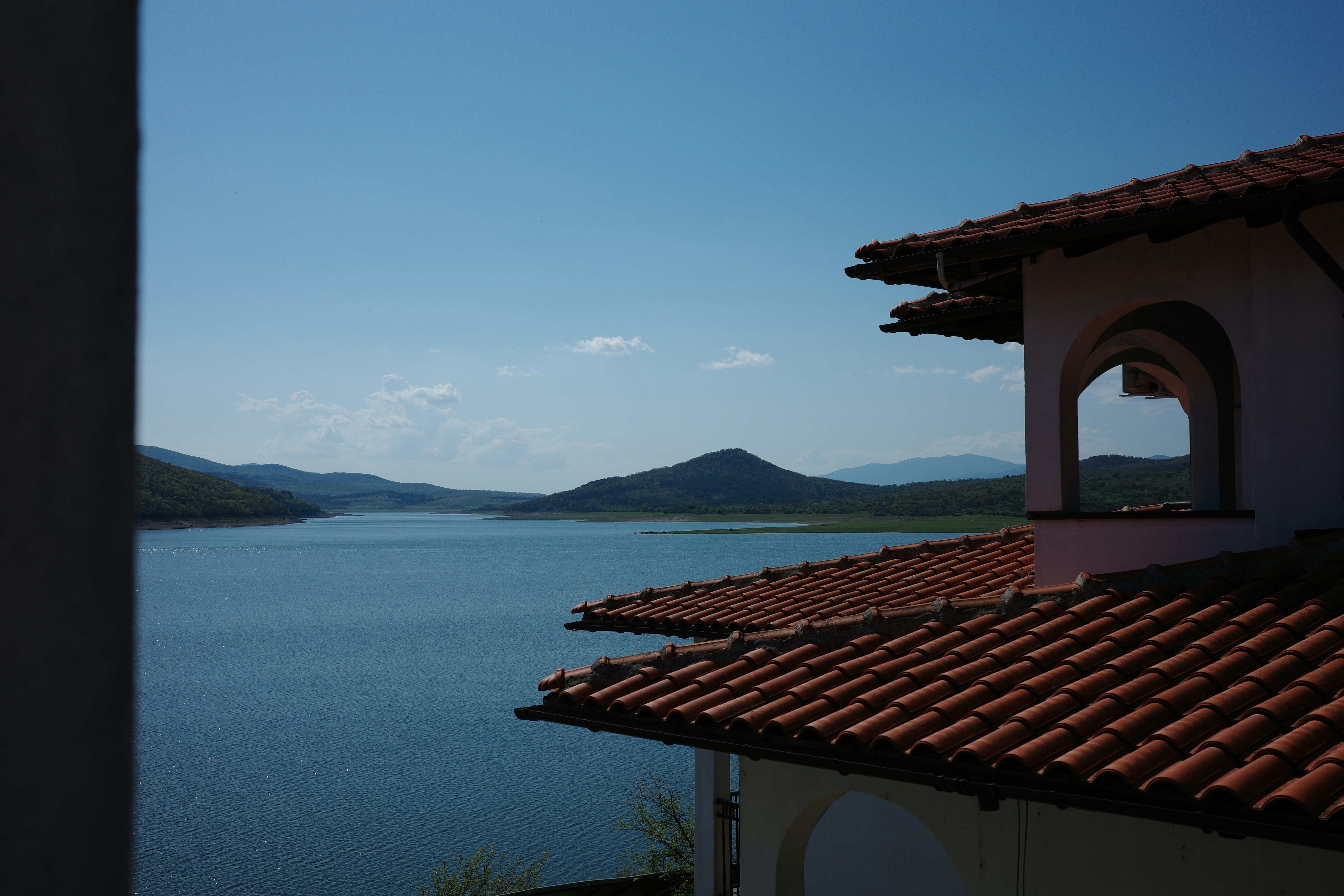 Terracotta Roofline framing a lakeside panorama