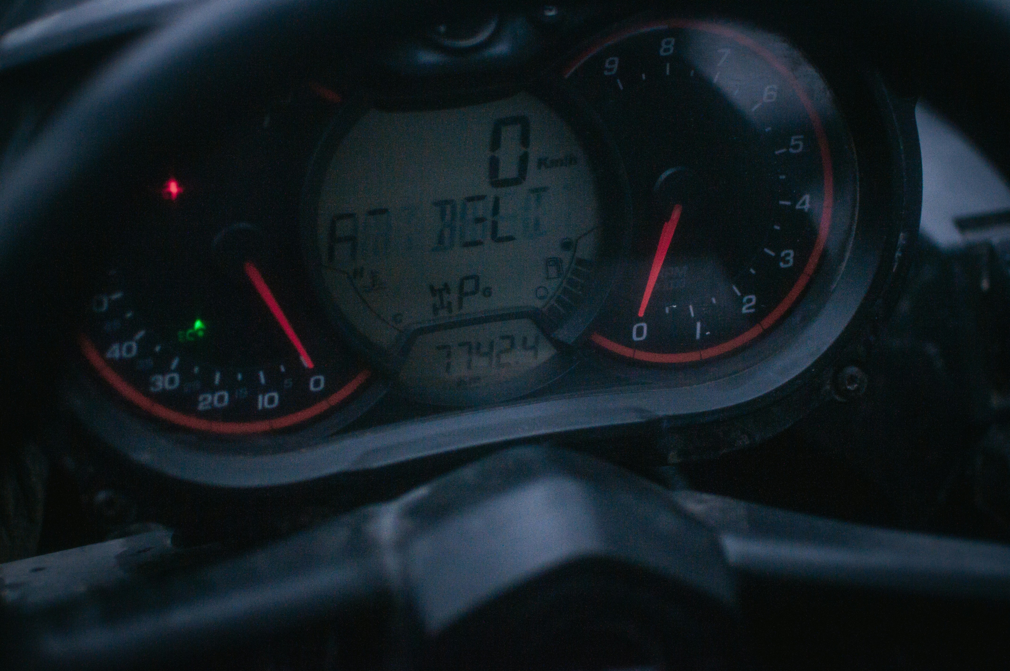 Steering Into the Unknown: Close-Up of a Car Dashboard at Dusk