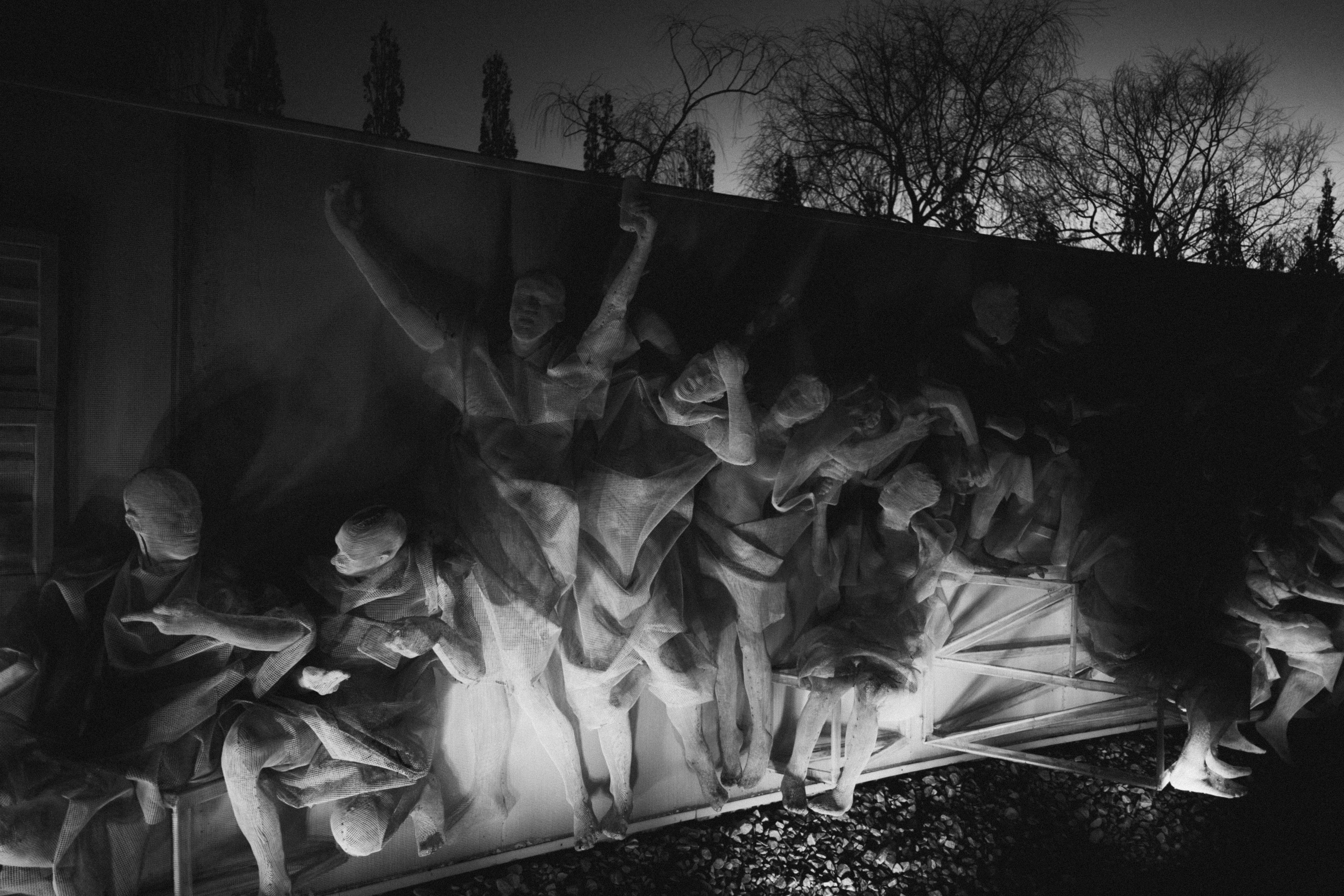 Movement in the Dark Train Car: a Ghostly Chorus of Bodies