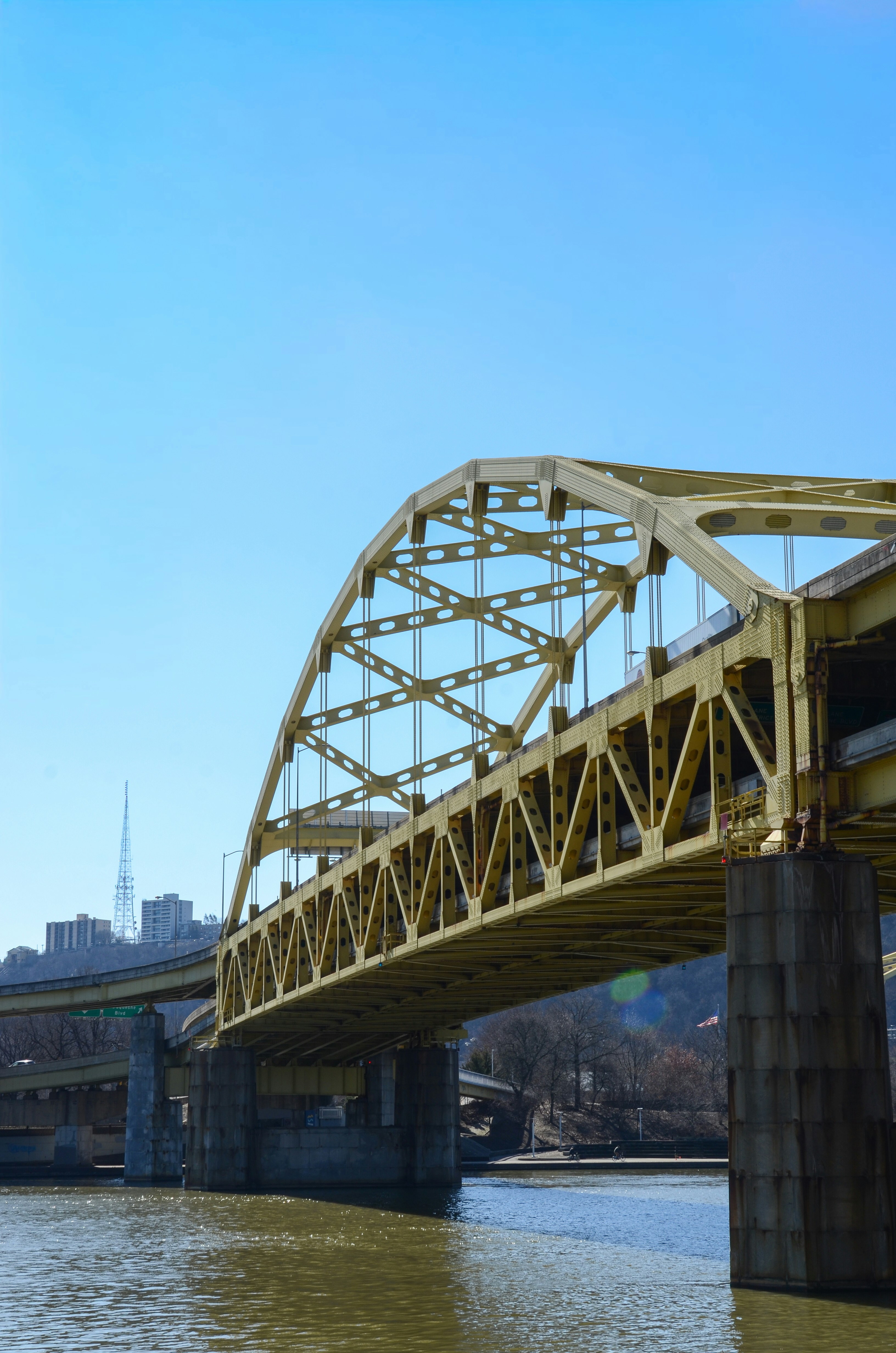 Yellow Arch of Steel Over Water