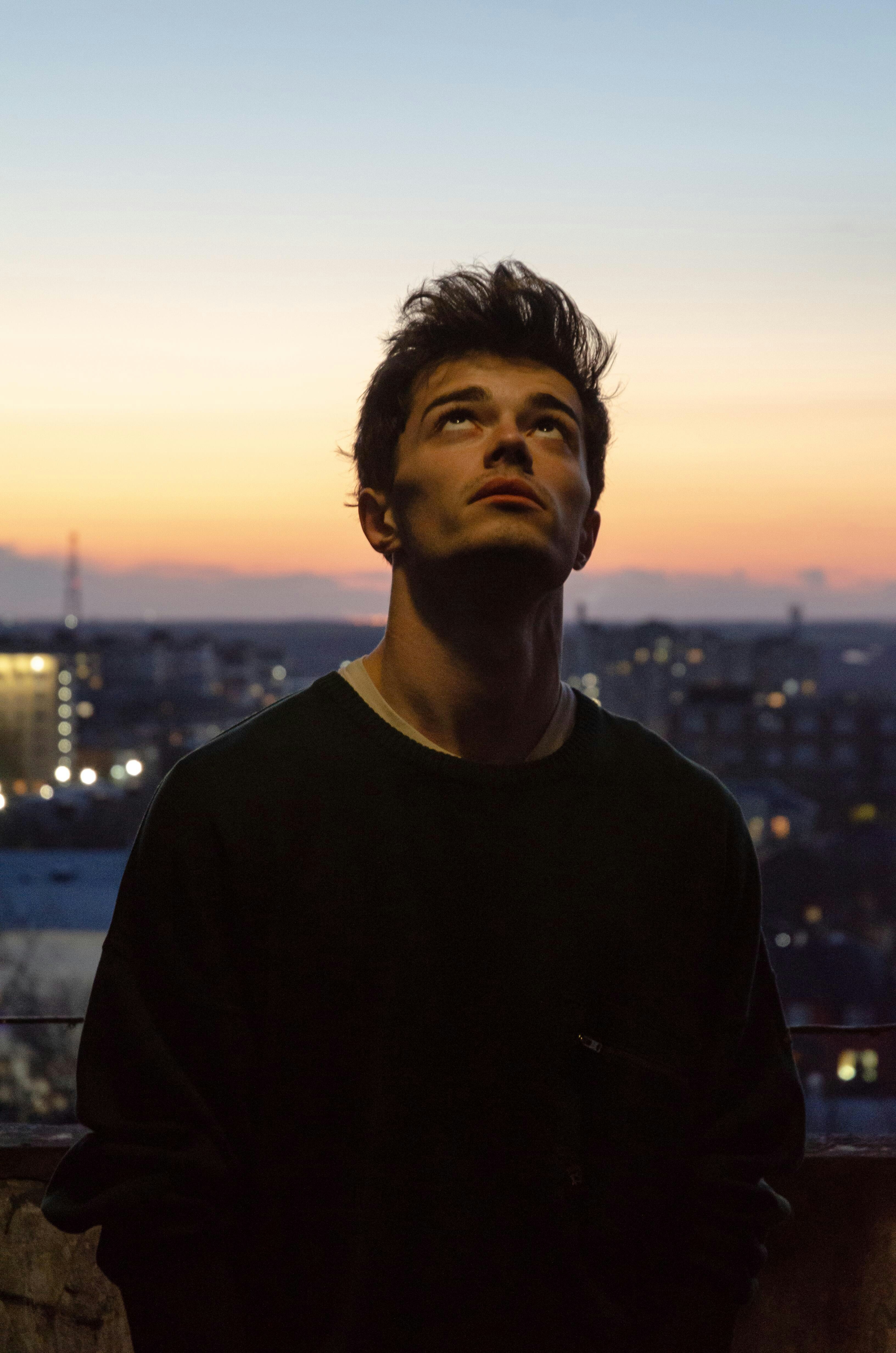 Eyes Lifted to the Dusk: A Quiet Rooftop Moment