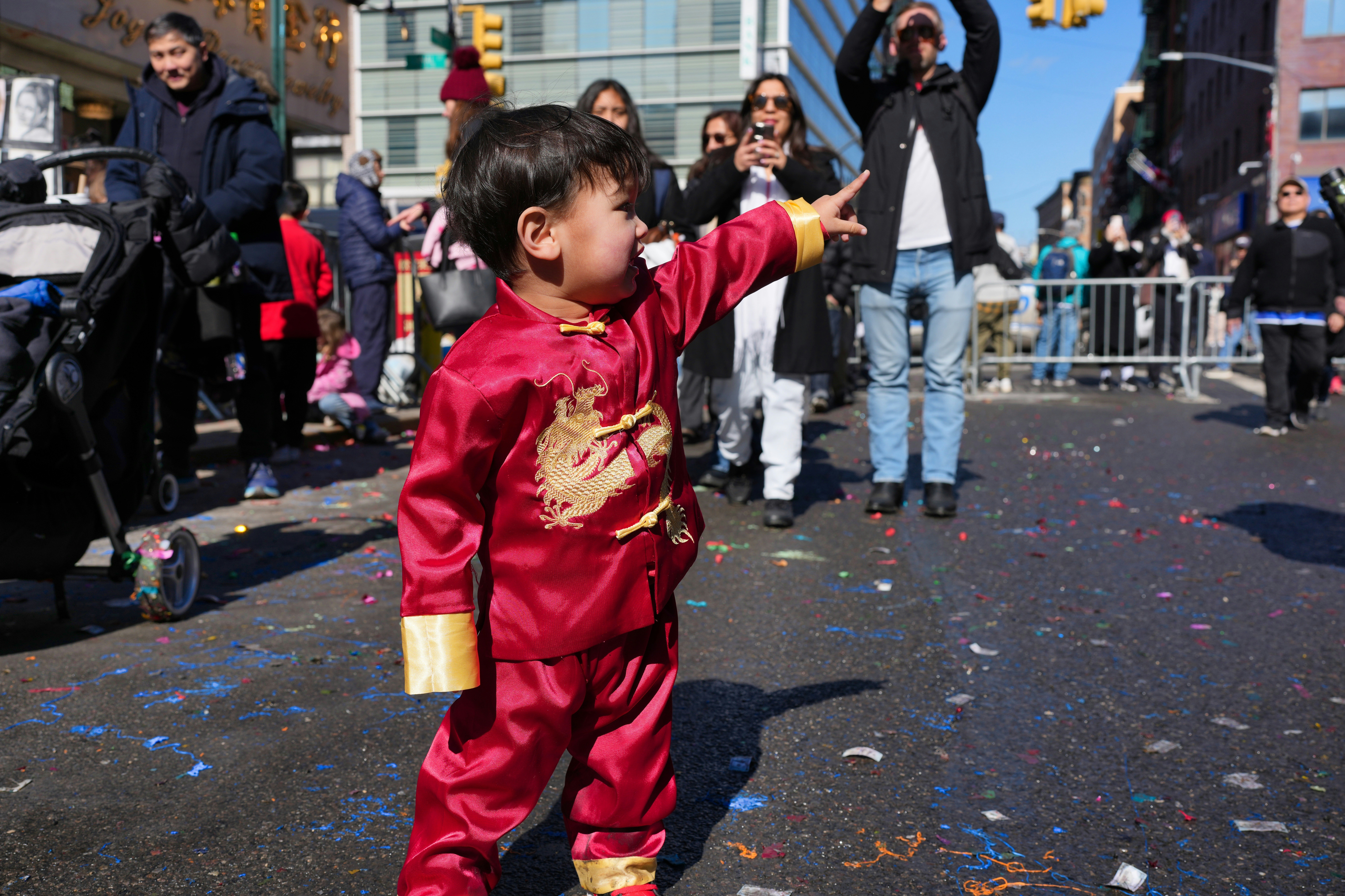 New York, New York - February 28, 2026: Traditional lion dance troupes and thousands of spectators gather on Hester Street for the "Super Saturday" Chinatown Lion Dance Festival and ceremonial firecracker display. Celebrating the 2026 Lunar New Year—the Year of the Fire Horse—the event features rhythmic drumming, vibrant costumes, and the traditional lighting of firecrackers to ward off evil spirits and bring good fortune. The massive street festival in Manhattan's Chinatown is a cornerstone of the city's cultural calendar, showcasing ancestral Chinese traditions, martial arts-infused dance performances, and community celebrations that draw residents and tourists to the historic neighborhood for the final peak of the New Year festivities.