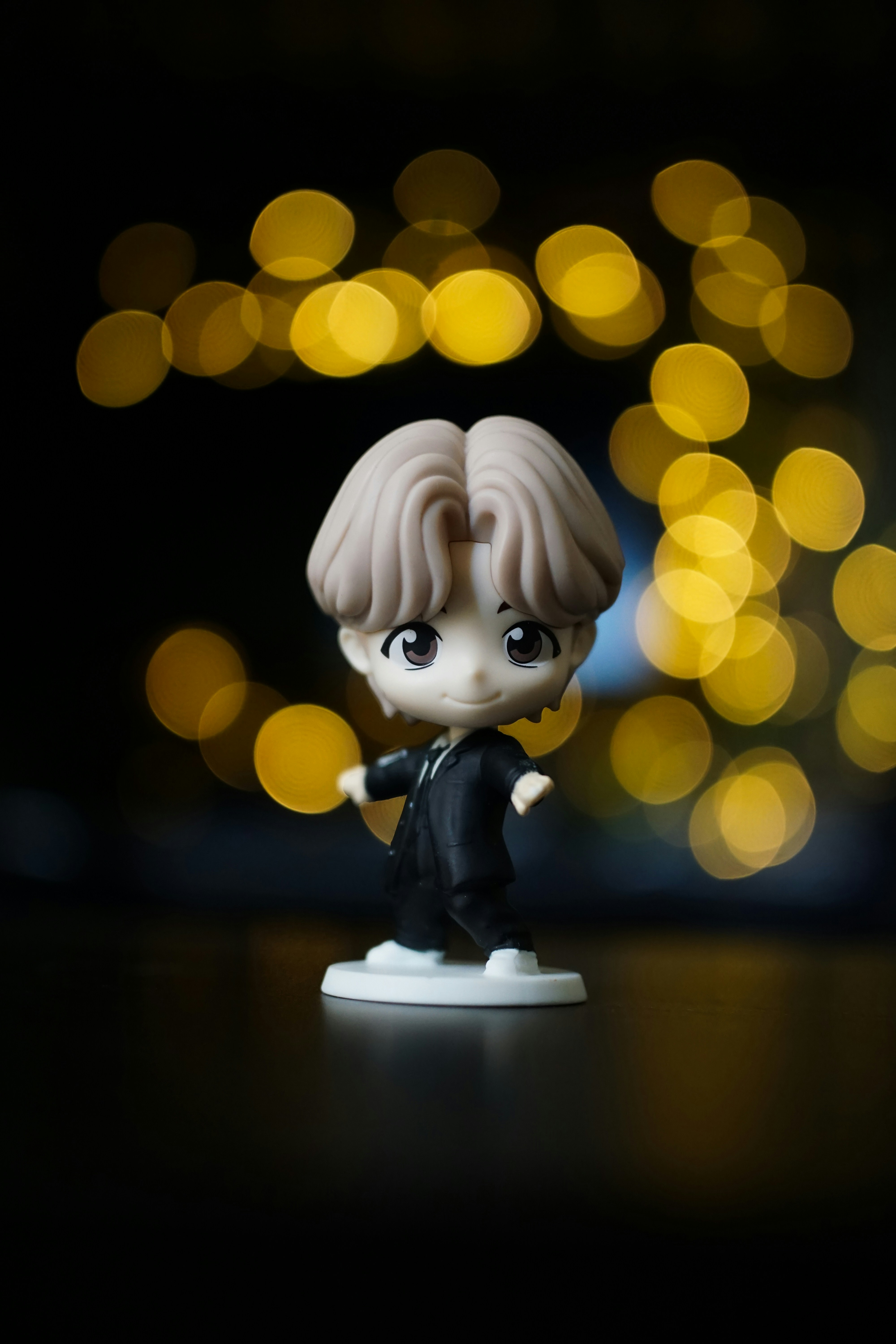 Tiny figure, big glow: a focus on whimsy against bokeh orbs