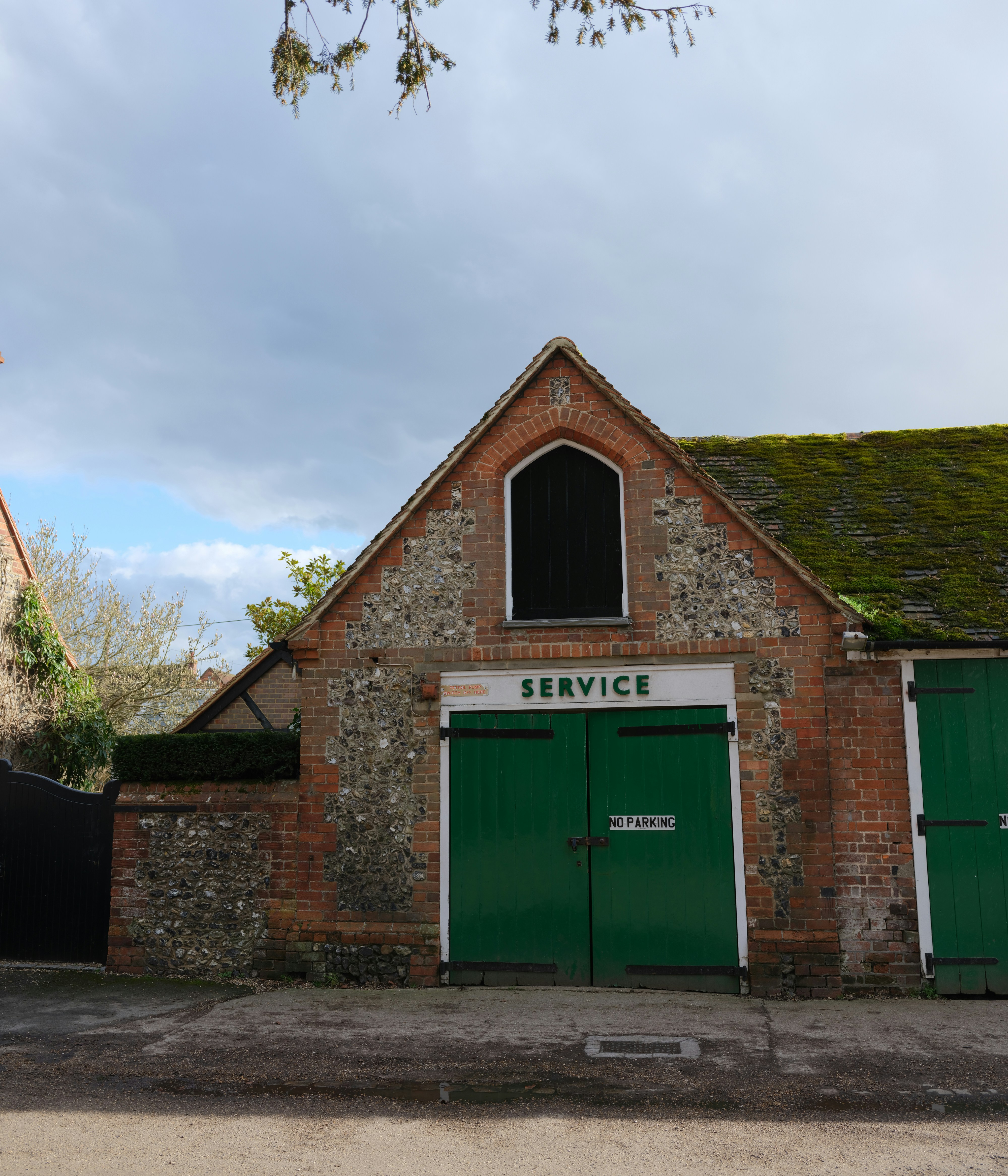 Green Doors and Weathered Beams: A Quiet Service Yard