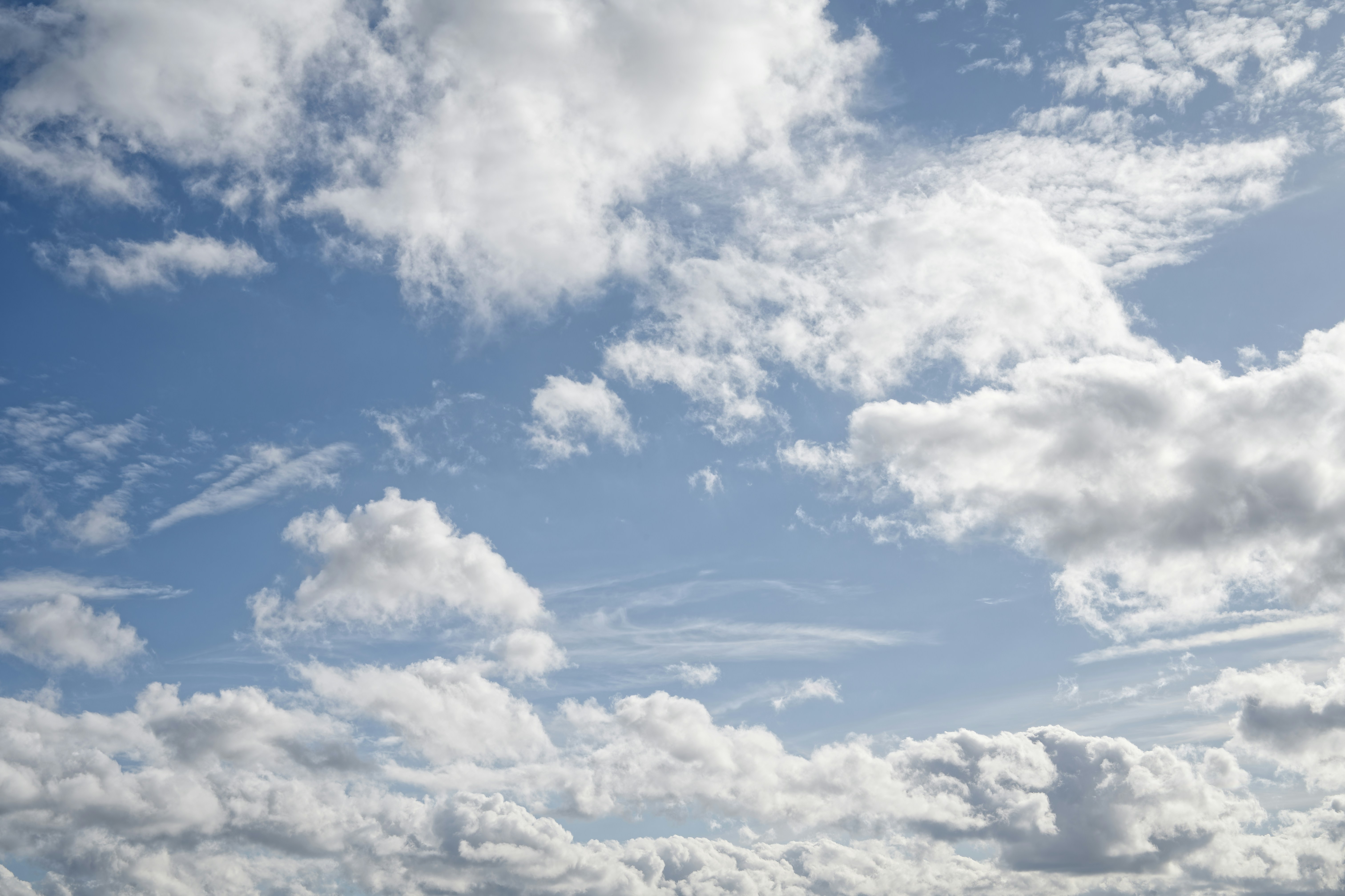 Blue Sky Mosaic: Sunlit Cloudscape with Soft Edges