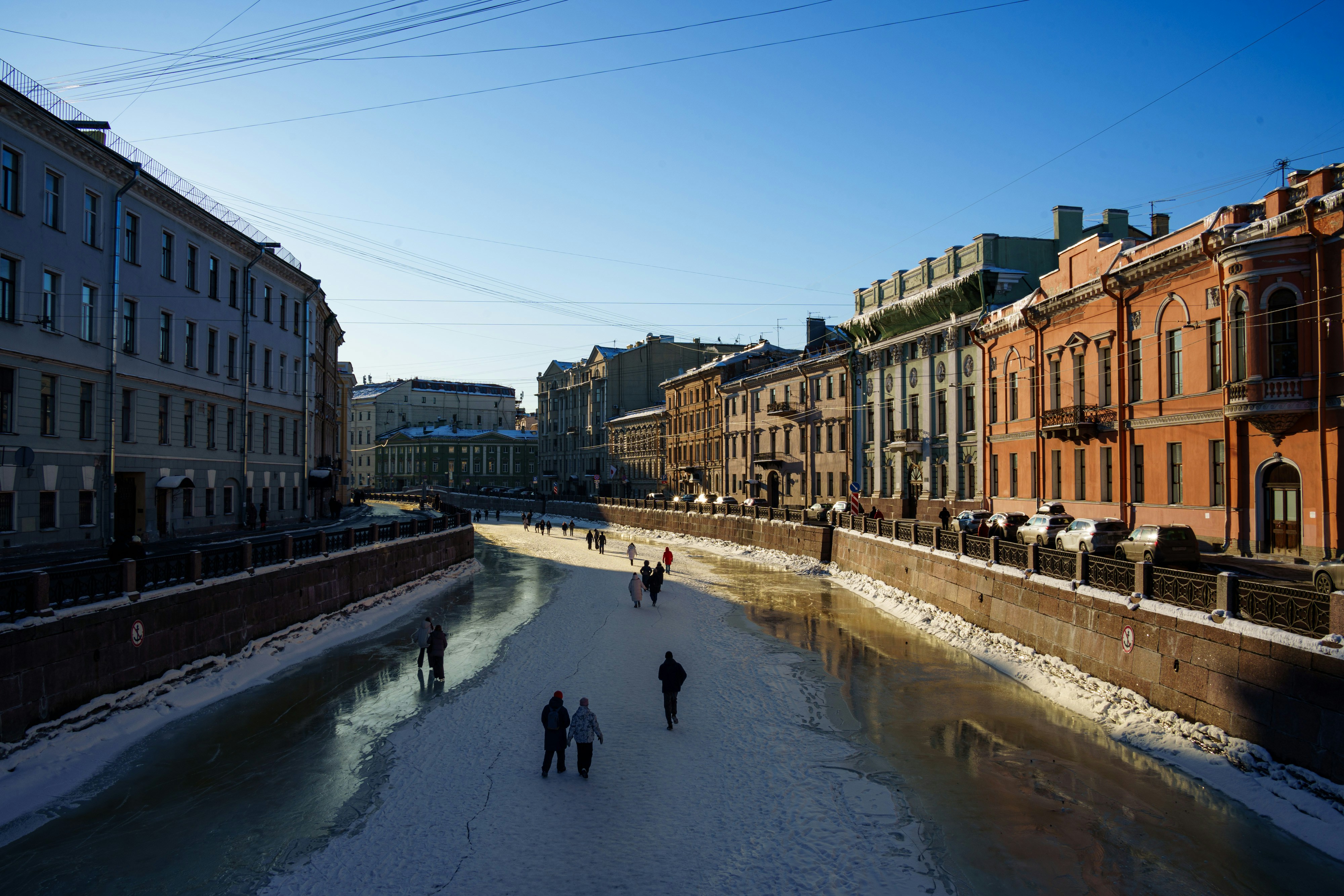 Frozen Canal Corridor: Ice-skating Beneath a Row of Historic Facades